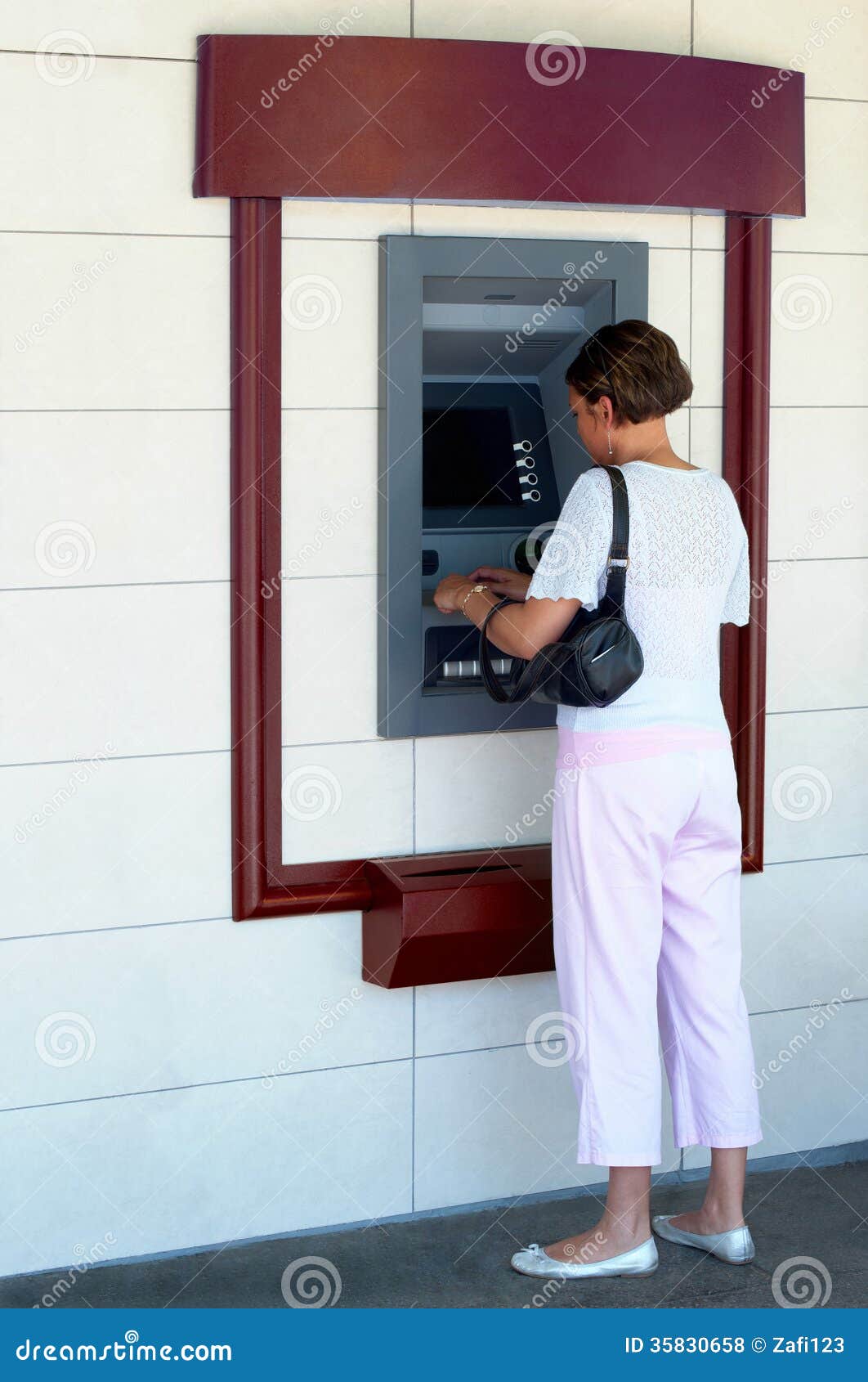 Woman at ATM stock photo. Image of pink, money, lifestyle - 35830658