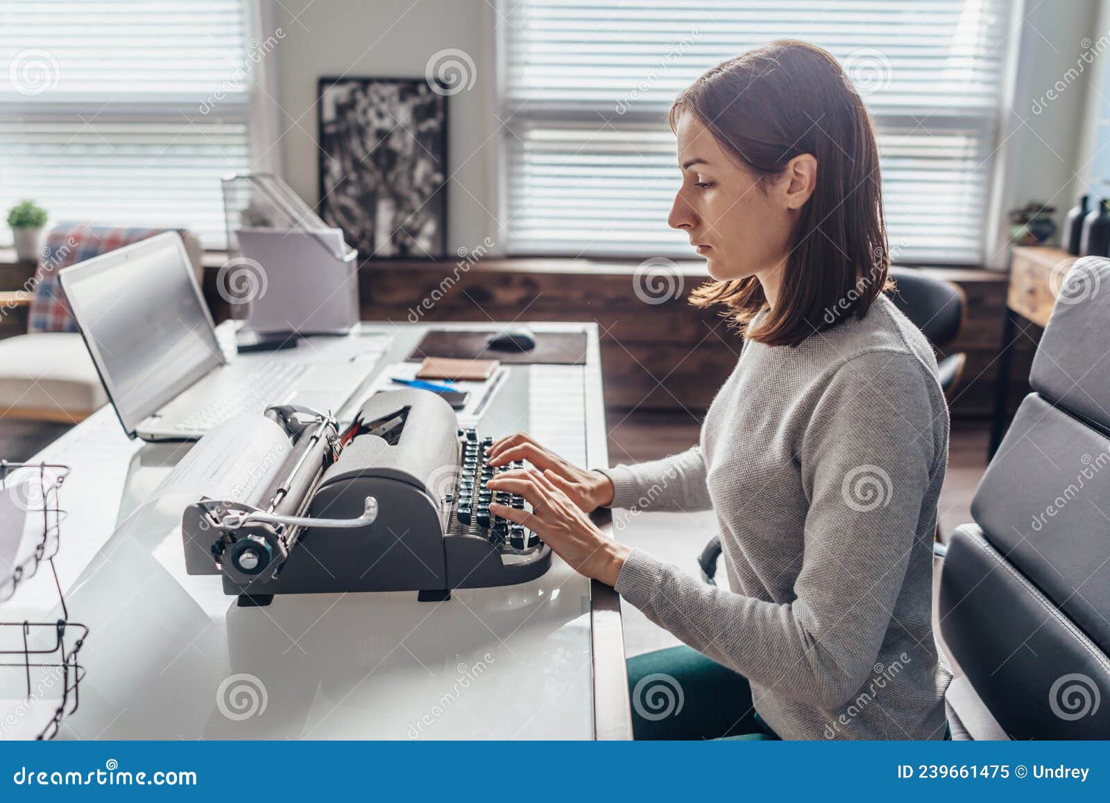 Woman Author Composes Text on a Typewriter Sitting in Her Working Room ...