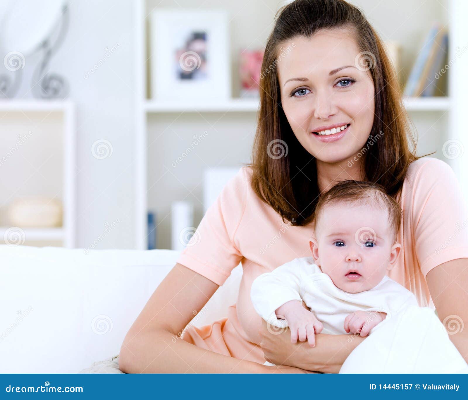 Woman with baby stock image. Image of hold, love, room - 14445157
