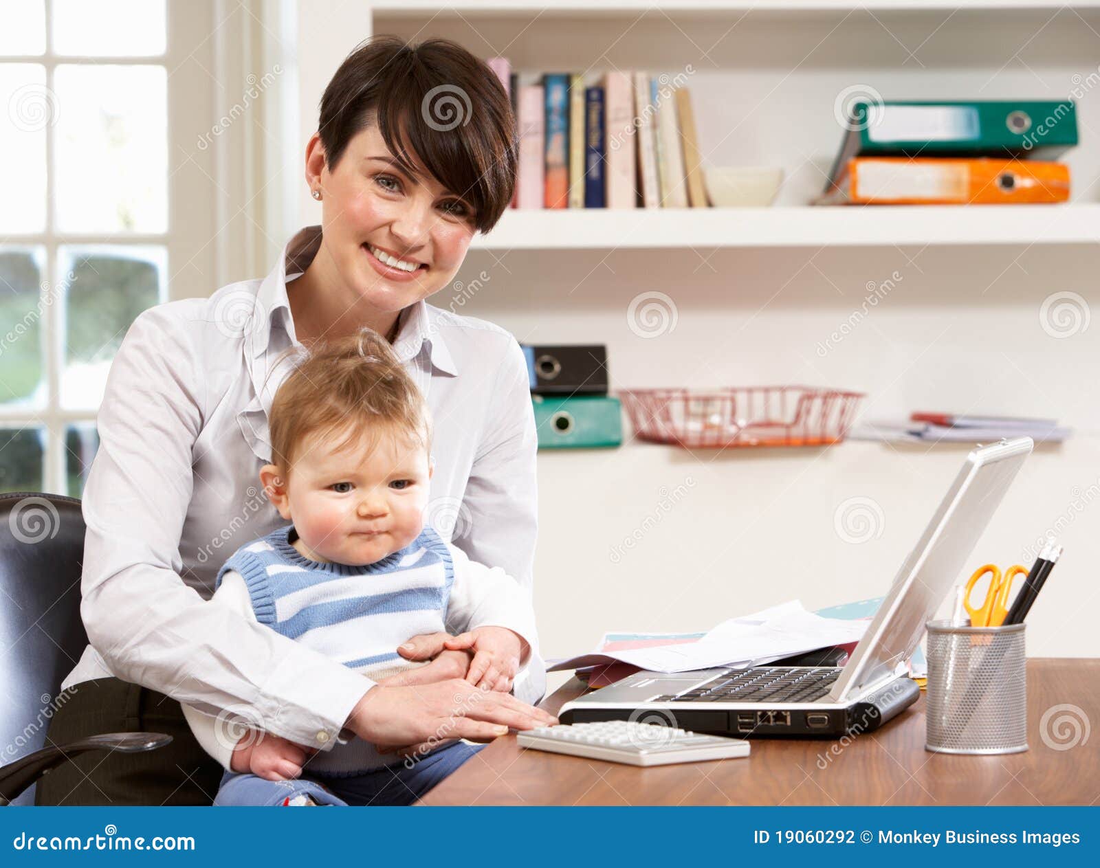 Woman with Baby Working from Home Using Laptop Stock Photo - Image of ...