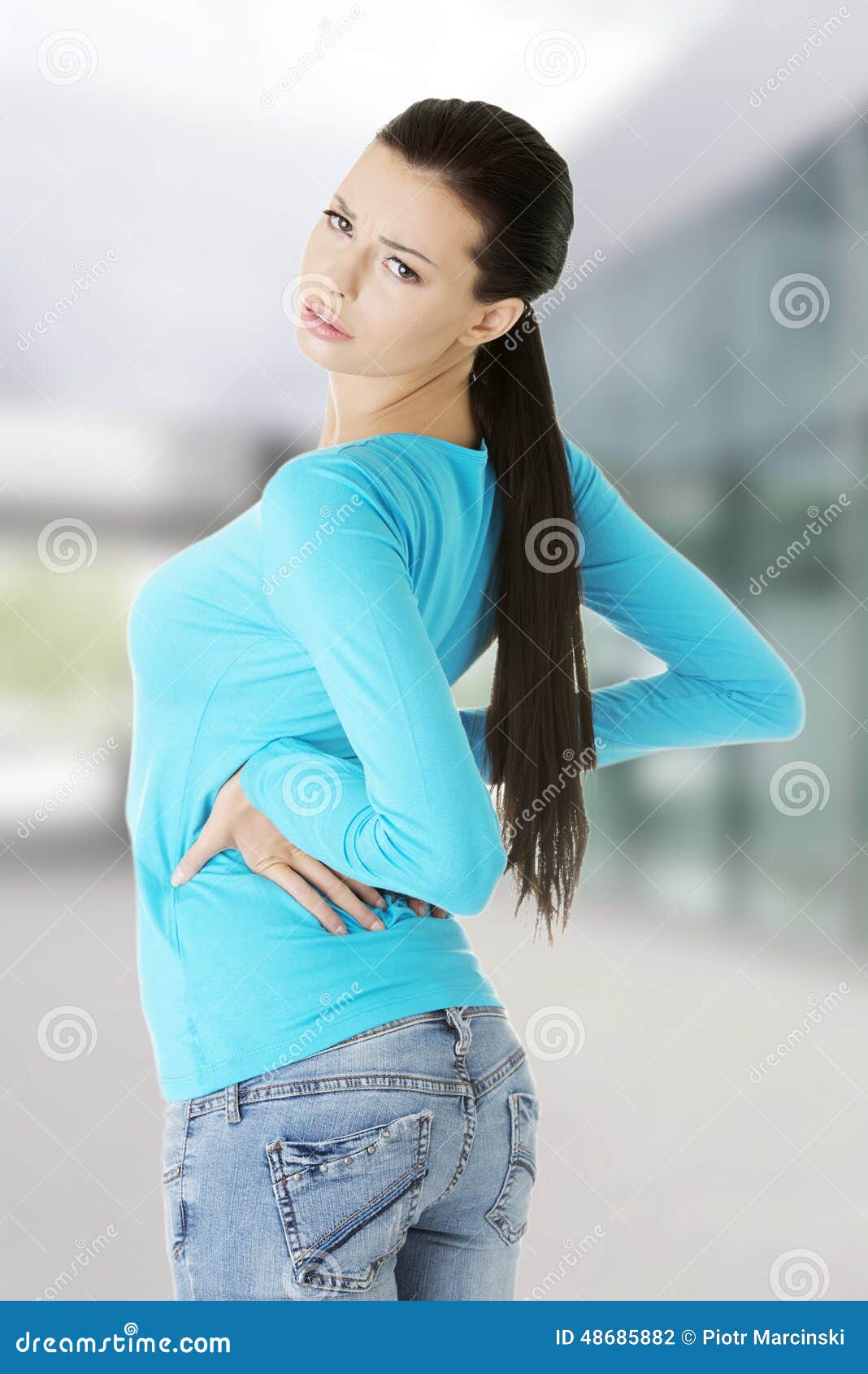 Woman with back pain stock photo. Image of injured, face - 48685882