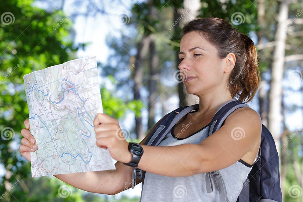 Woman with Backpack Checking Map Stock Image - Image of printed ...