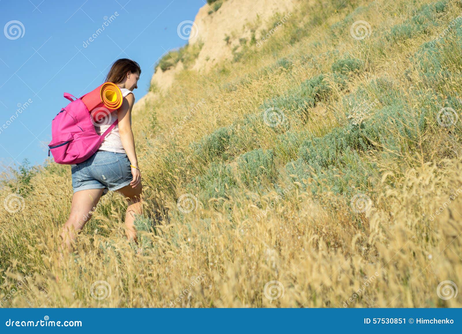 A Woman with a Backpack Climbs Up the Hill Stock Image - Image of slope ...