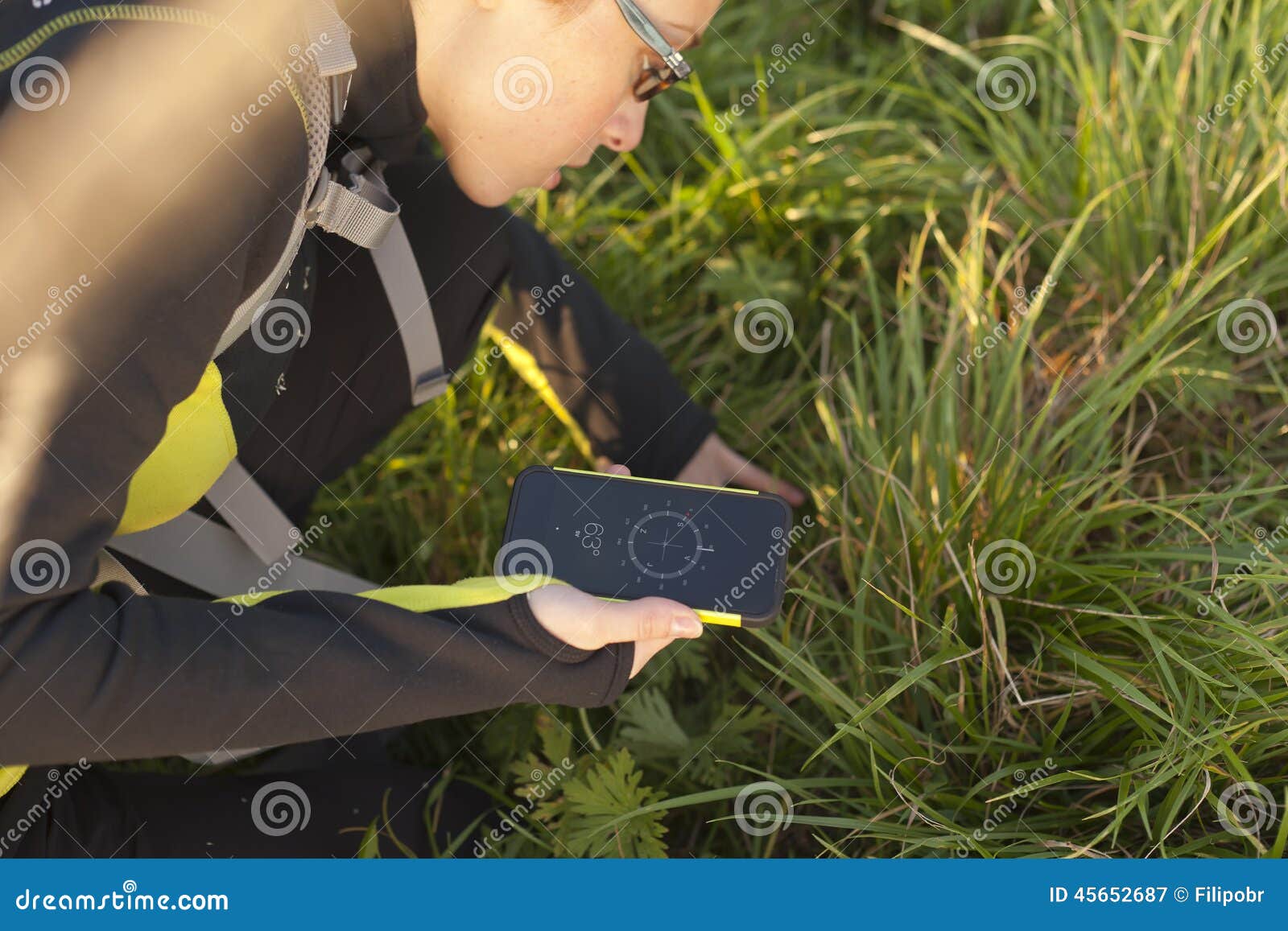 Woman with Backpack Geocaching with Digital Compass Stock Image - Image ...