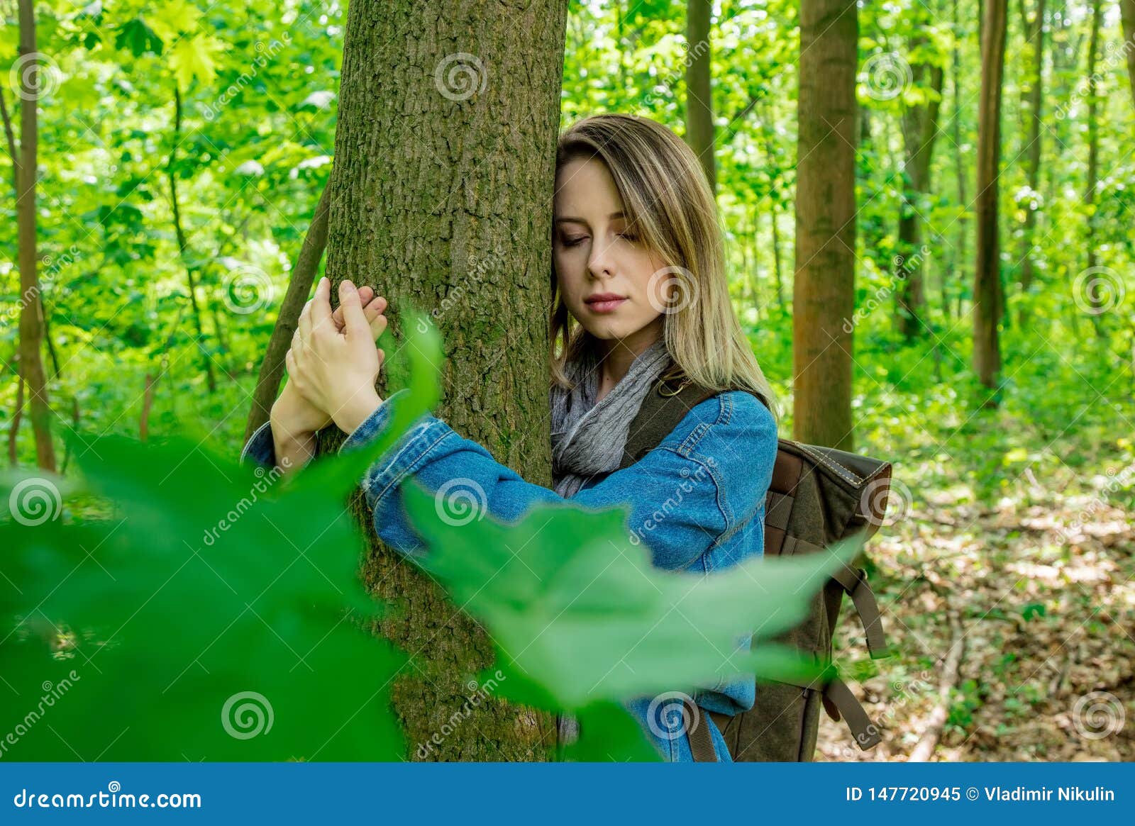 Woman with Backpack Hugging a Tree in Forest Stock Image - Image of ...