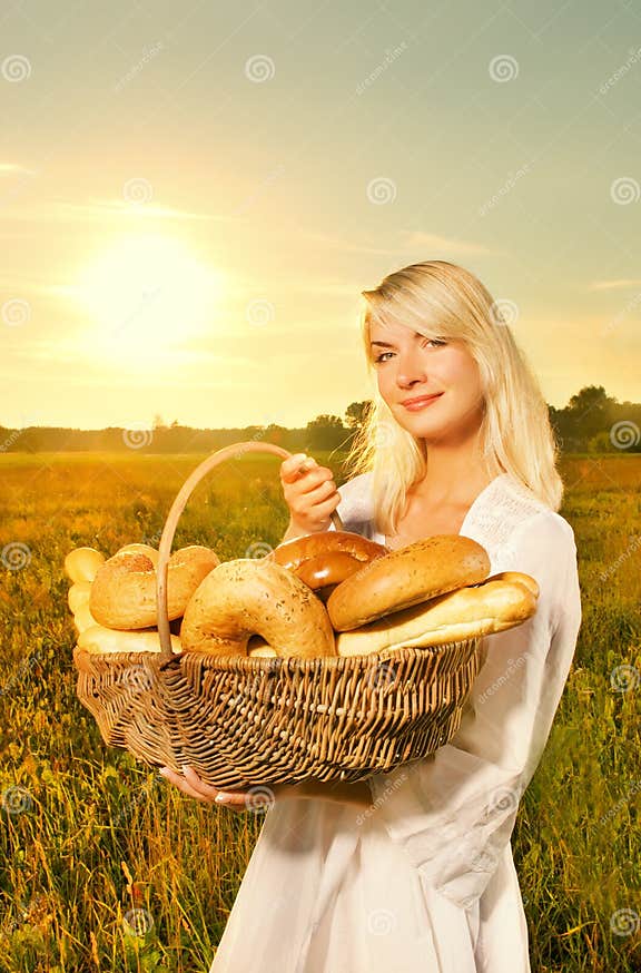 Woman with a baked bread stock image. Image of close, beauty - 6199689