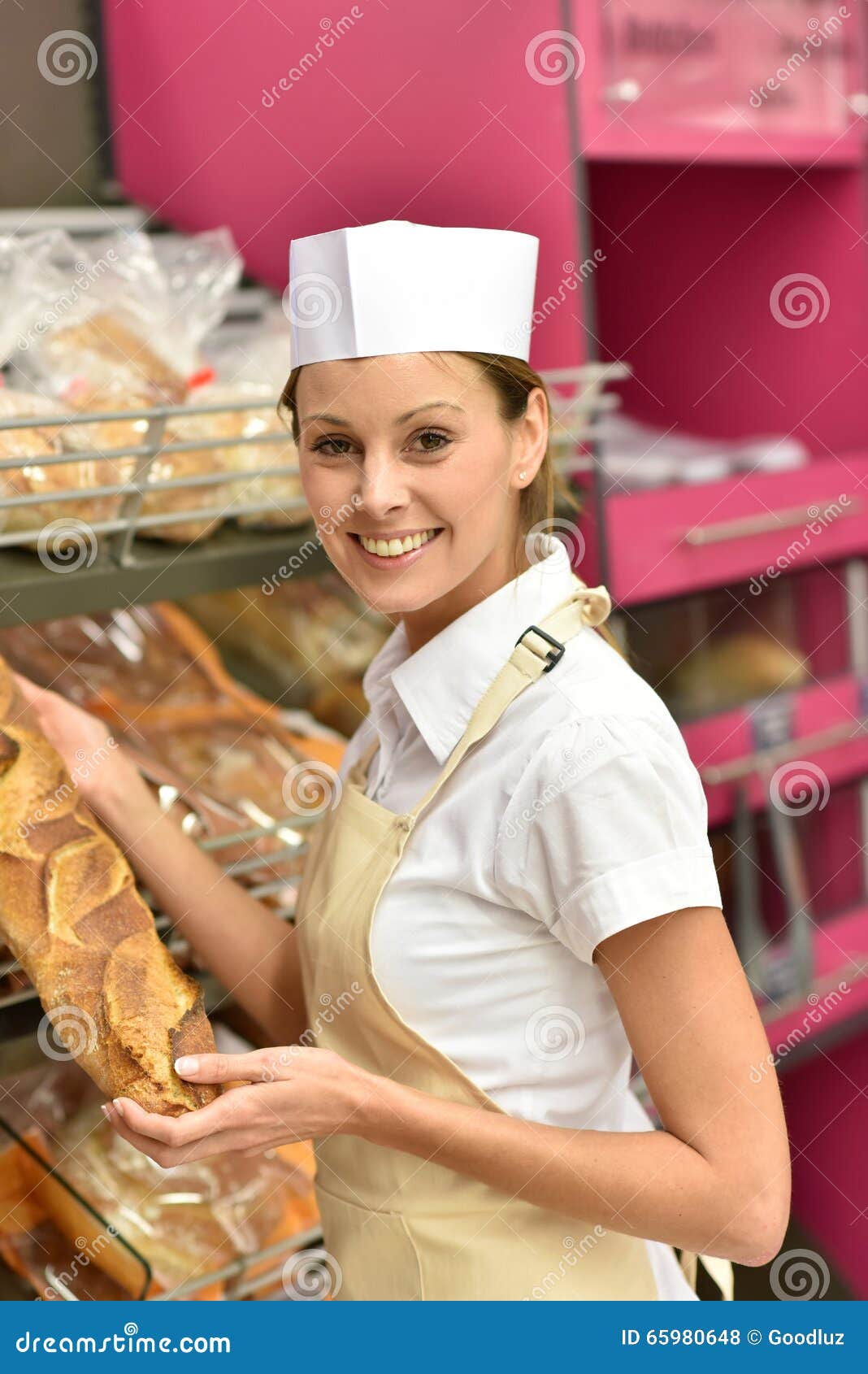 Woman baker selling bread stock photo. Image of looking - 65980648