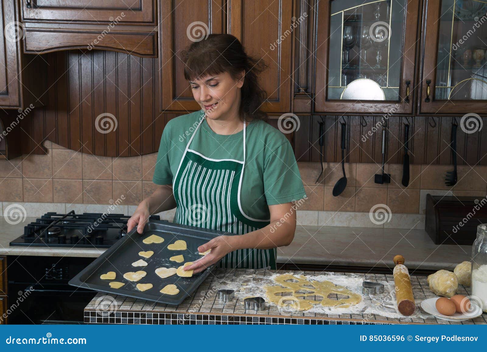 The Woman Bakes Cookies in the Kitchen Stock Photo - Image of ...