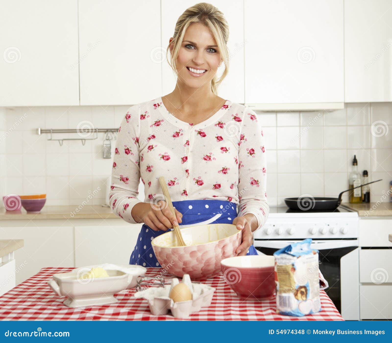 Woman Baking in Kitchen stock photo. Image of happy, blonde - 54974348