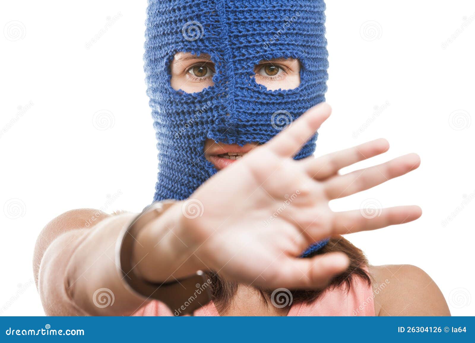 A Woman In A Balaclava Mask Is Standing With Flowers. Bandit Sniffs A ...