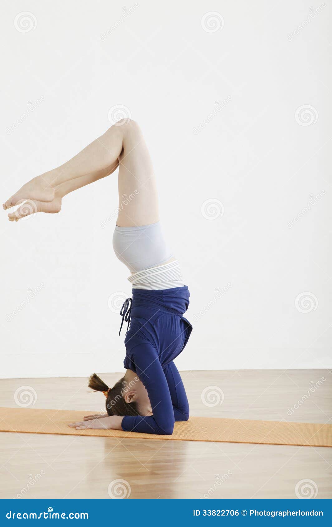 Woman Balancing on Head stock photo. Image of meditating - 33822706