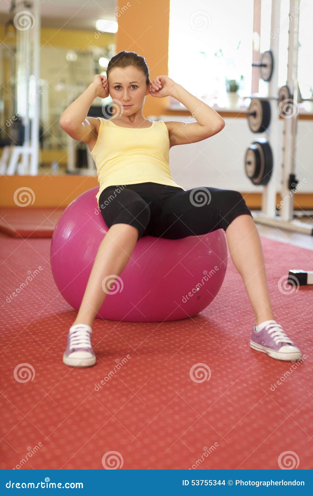 Woman Balancing on Swiss Ball Stock Photo - Image of lifting, sporting ...
