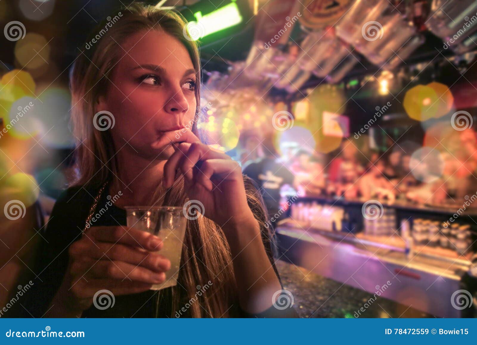 Woman in a bar stock image. Image of entertainment, colorful - 78472559