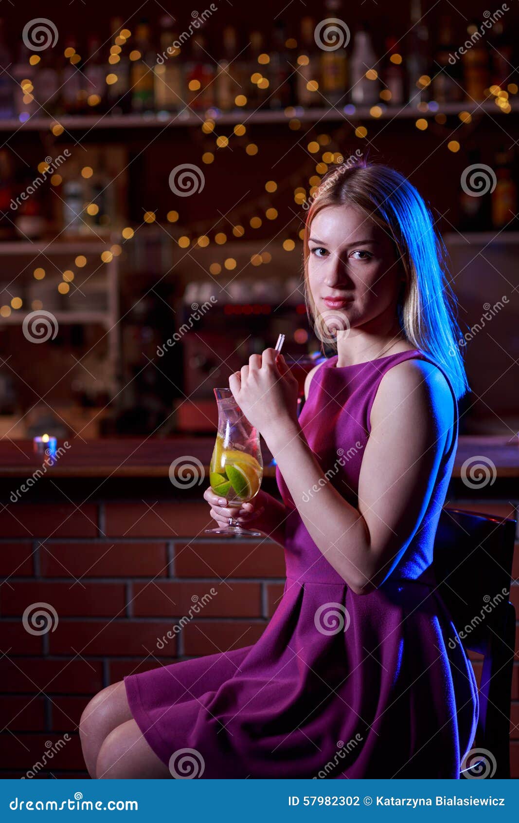 Woman at bar stock photo. Image of beverage, hold, color - 57982302