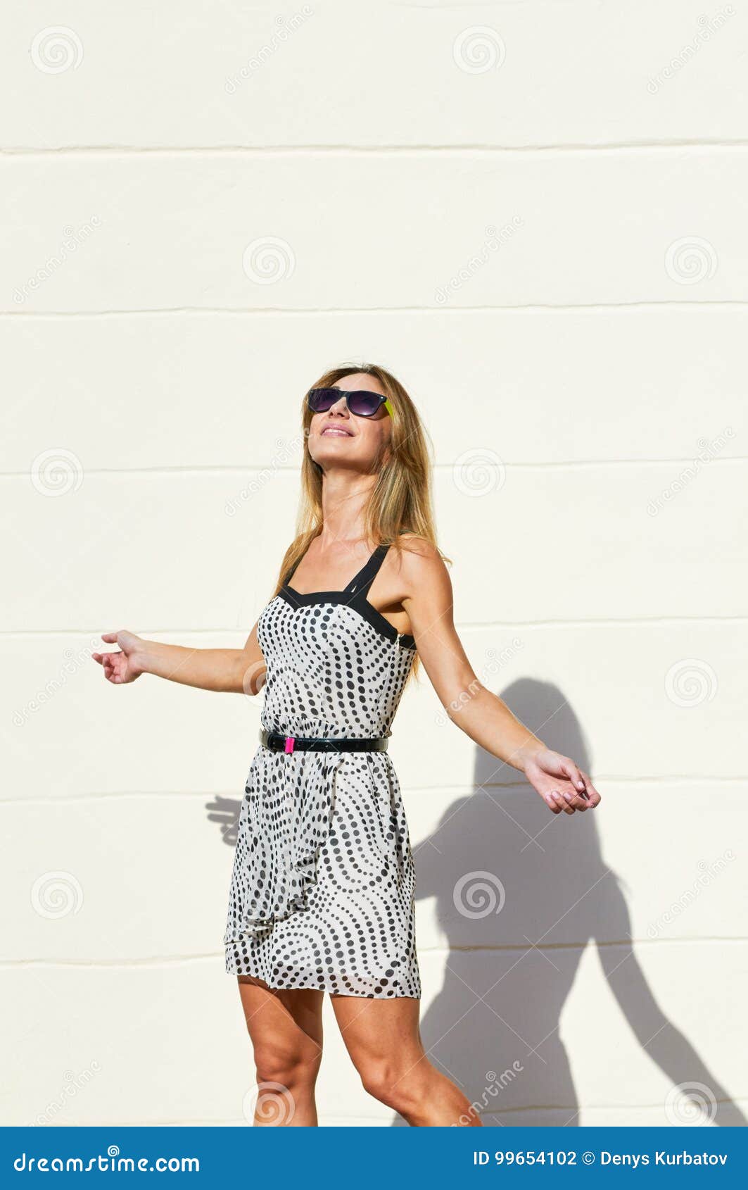 Woman basking in the sun stock photo. Image of model - 99654102