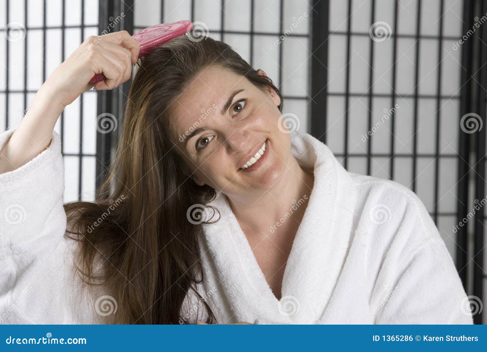 Woman in a Bath Robe Brushing Her Hair Stock Photo - Image of beauty ...