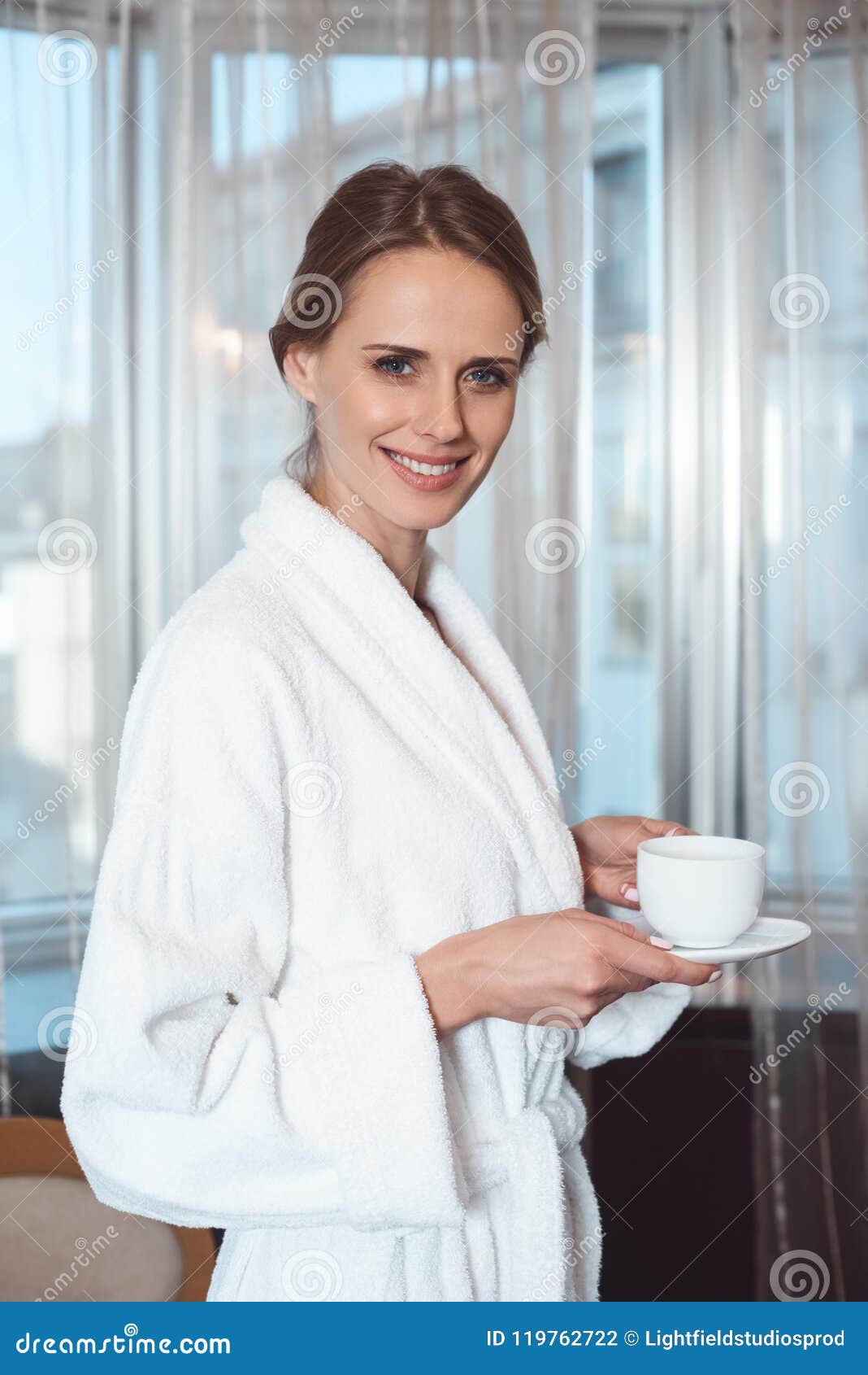 Woman in Bathrobe Holding Cup of Coffee and Smiling Stock Photo - Image ...