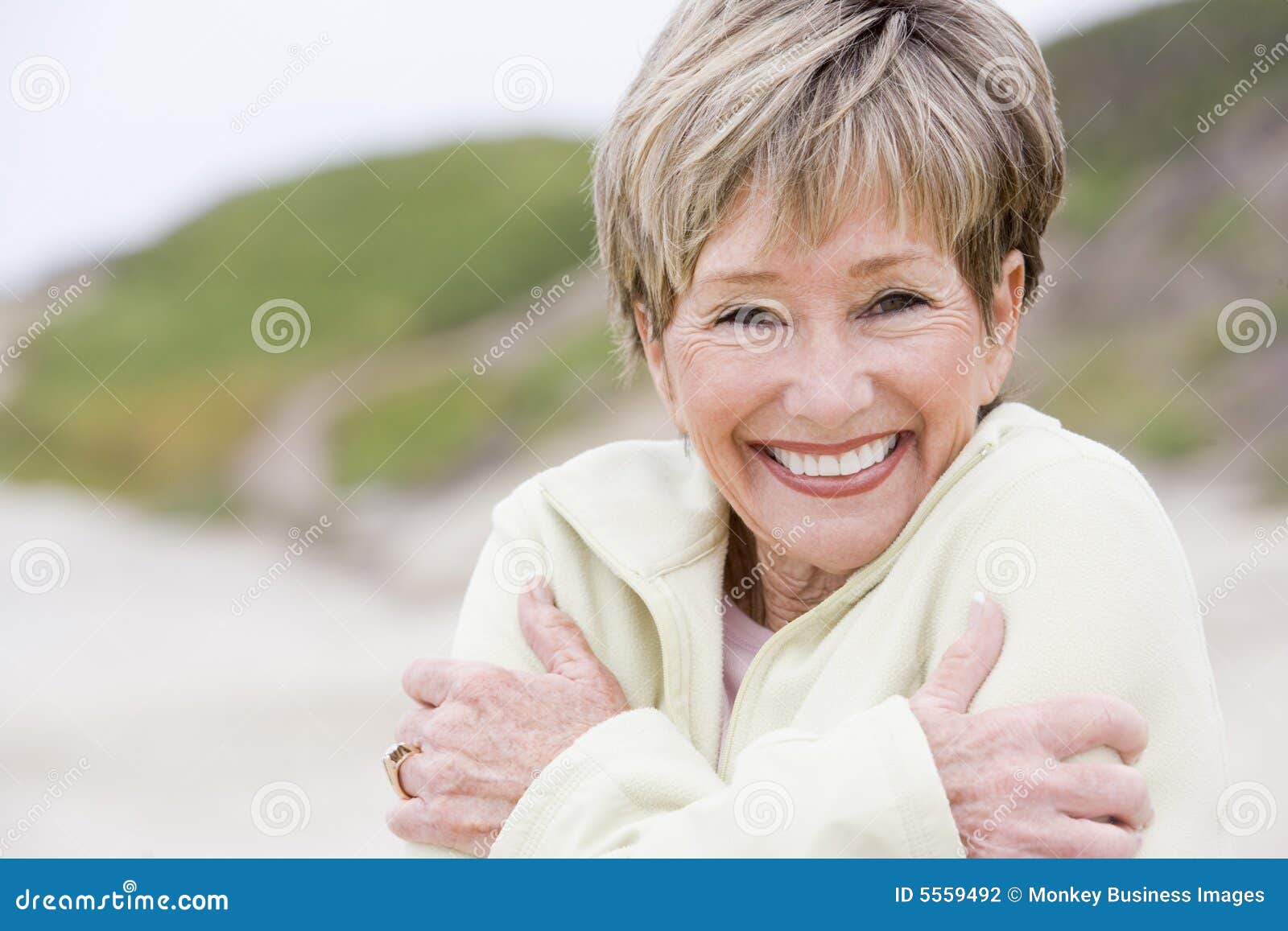 Woman at the Beach Cold and Smiling Stock Photo - Image of copy, senior ...
