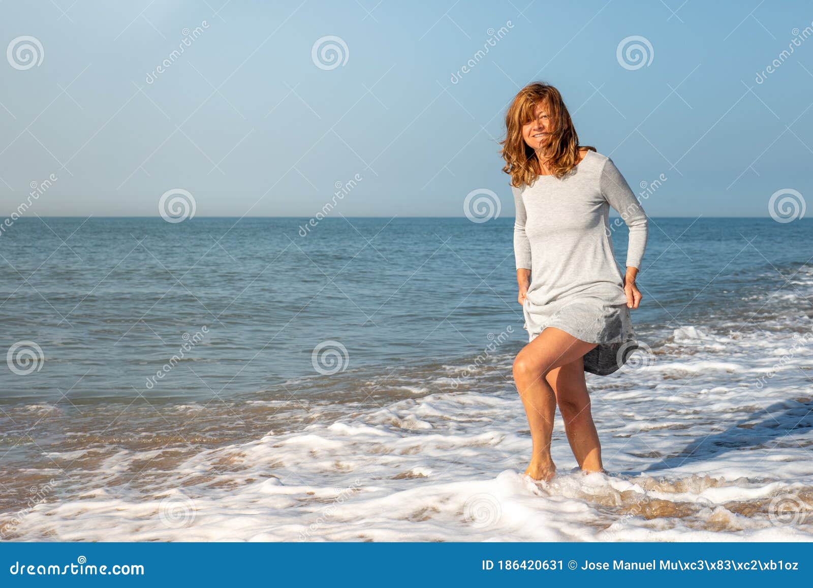 Woman on the Beach Playing with the Waves Stock Image - Image of copy ...