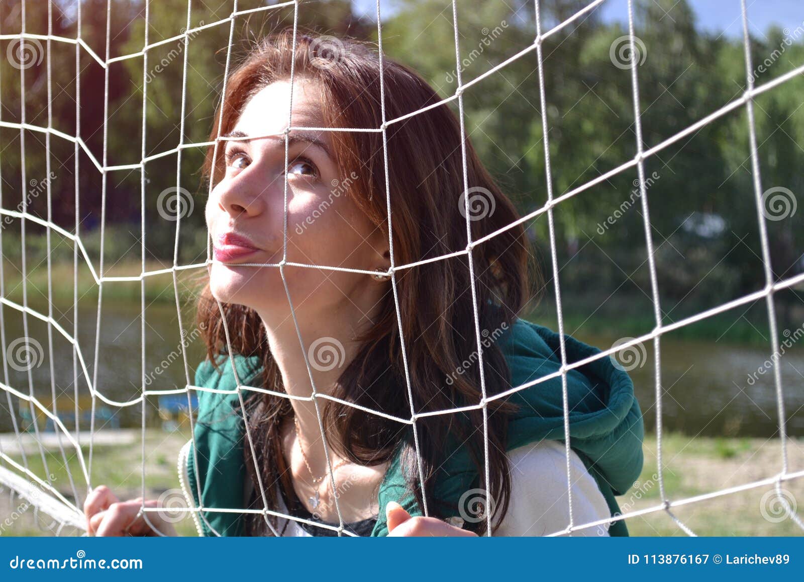 Beautiful Woman on the Beach Posing with a Volleyball Net. Stock Image ...