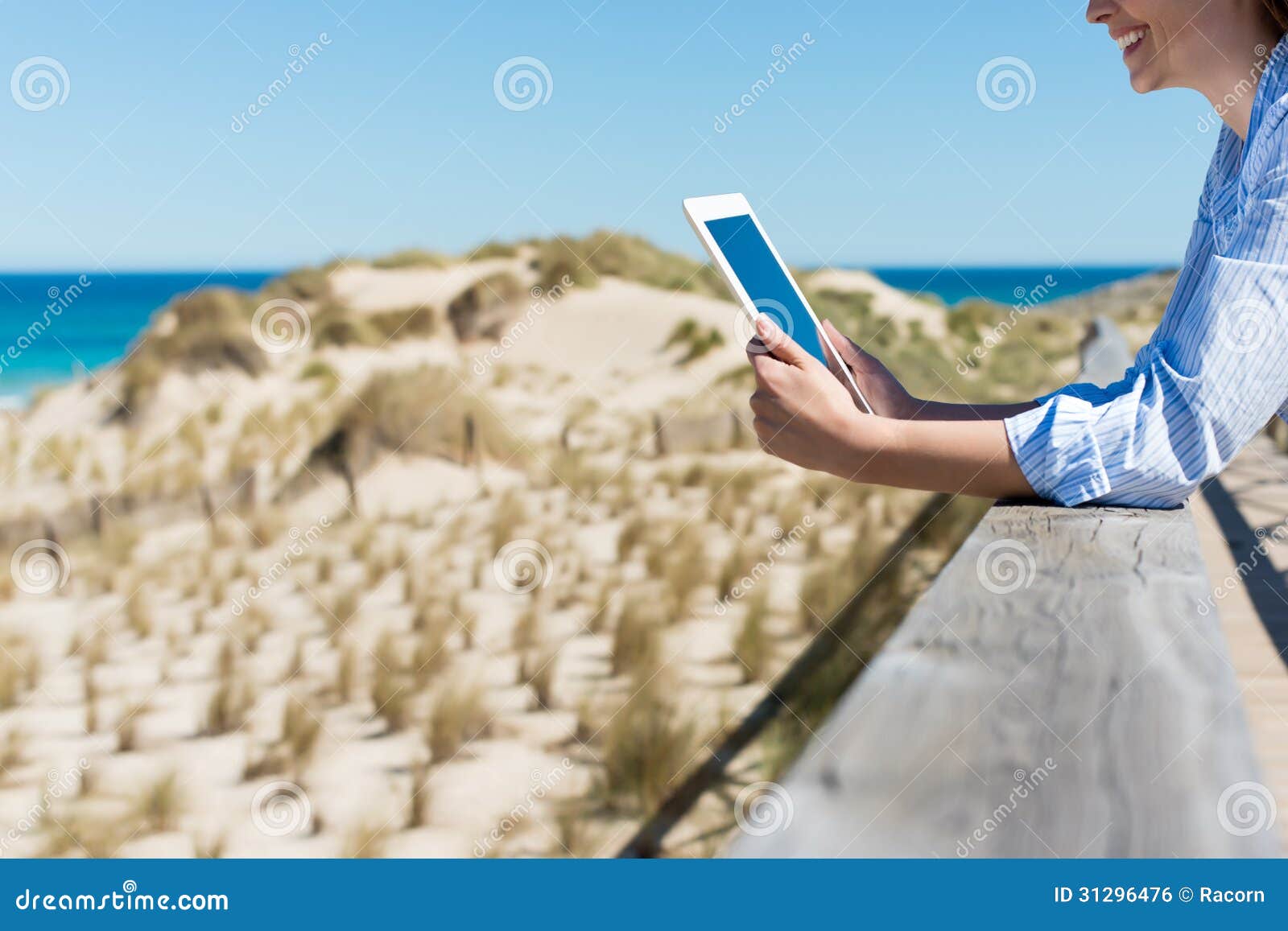 Woman by the Beach Reading on Tablet-pc Stock Photo - Image of shirt ...