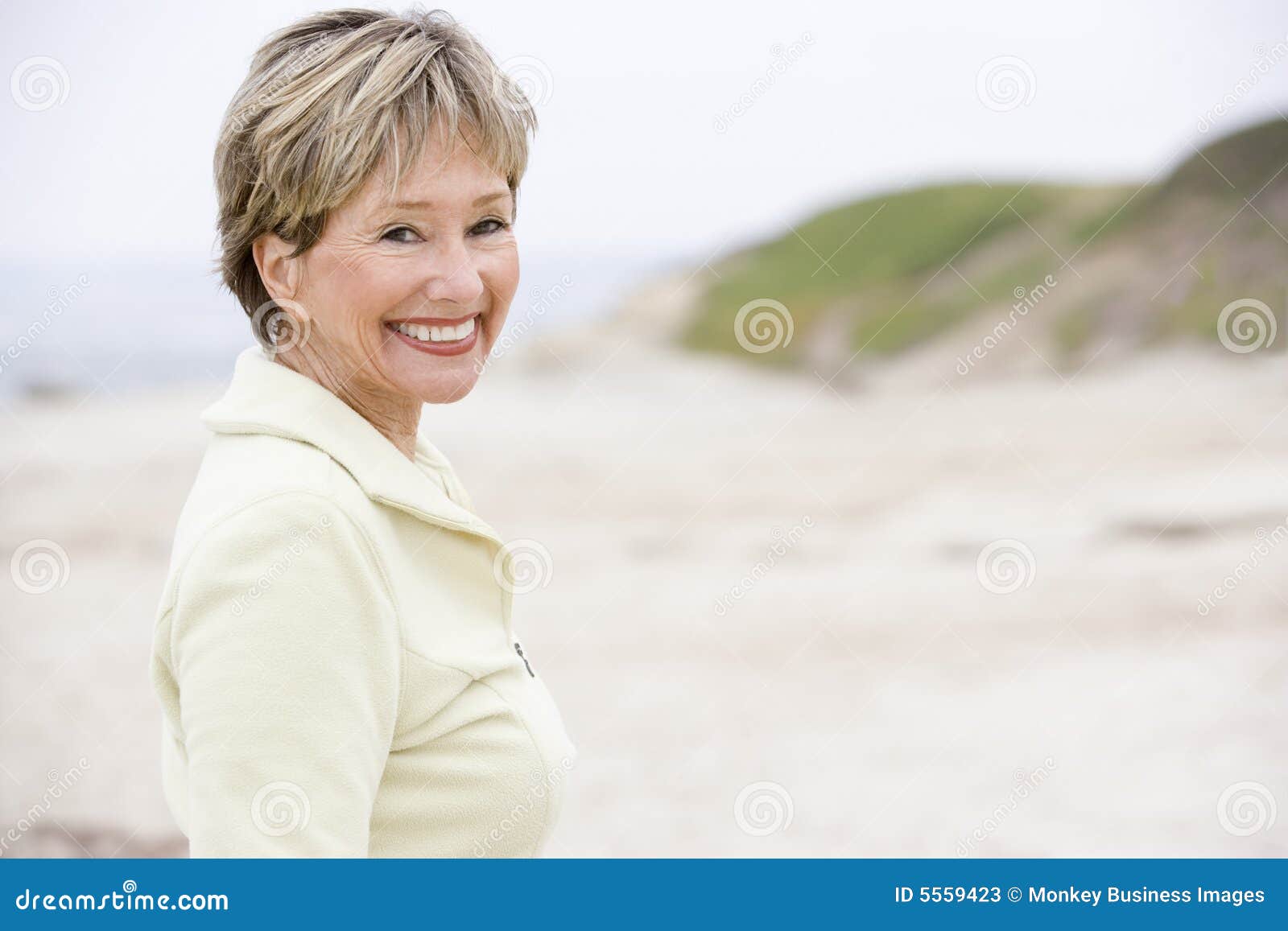 Woman at the beach smiling stock image. Image of person - 5559423