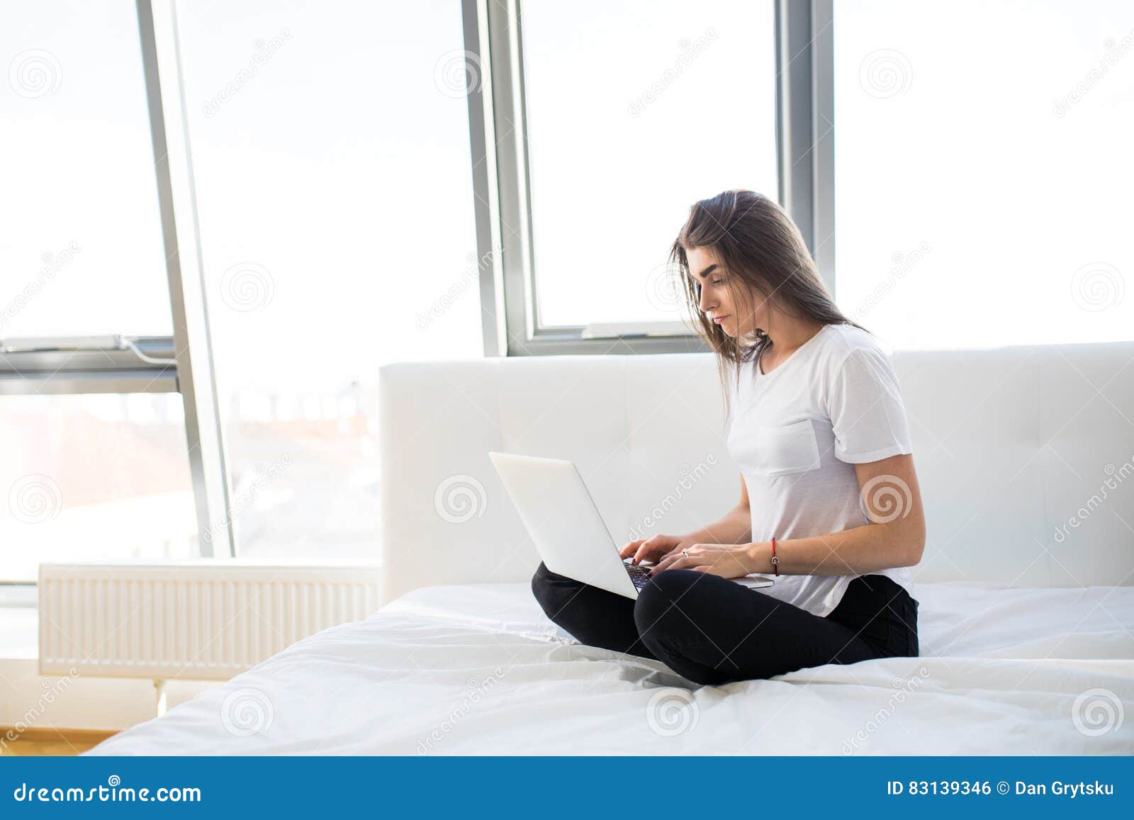 Woman in bed with laptop stock photo. Image of legs, computer - 83139346
