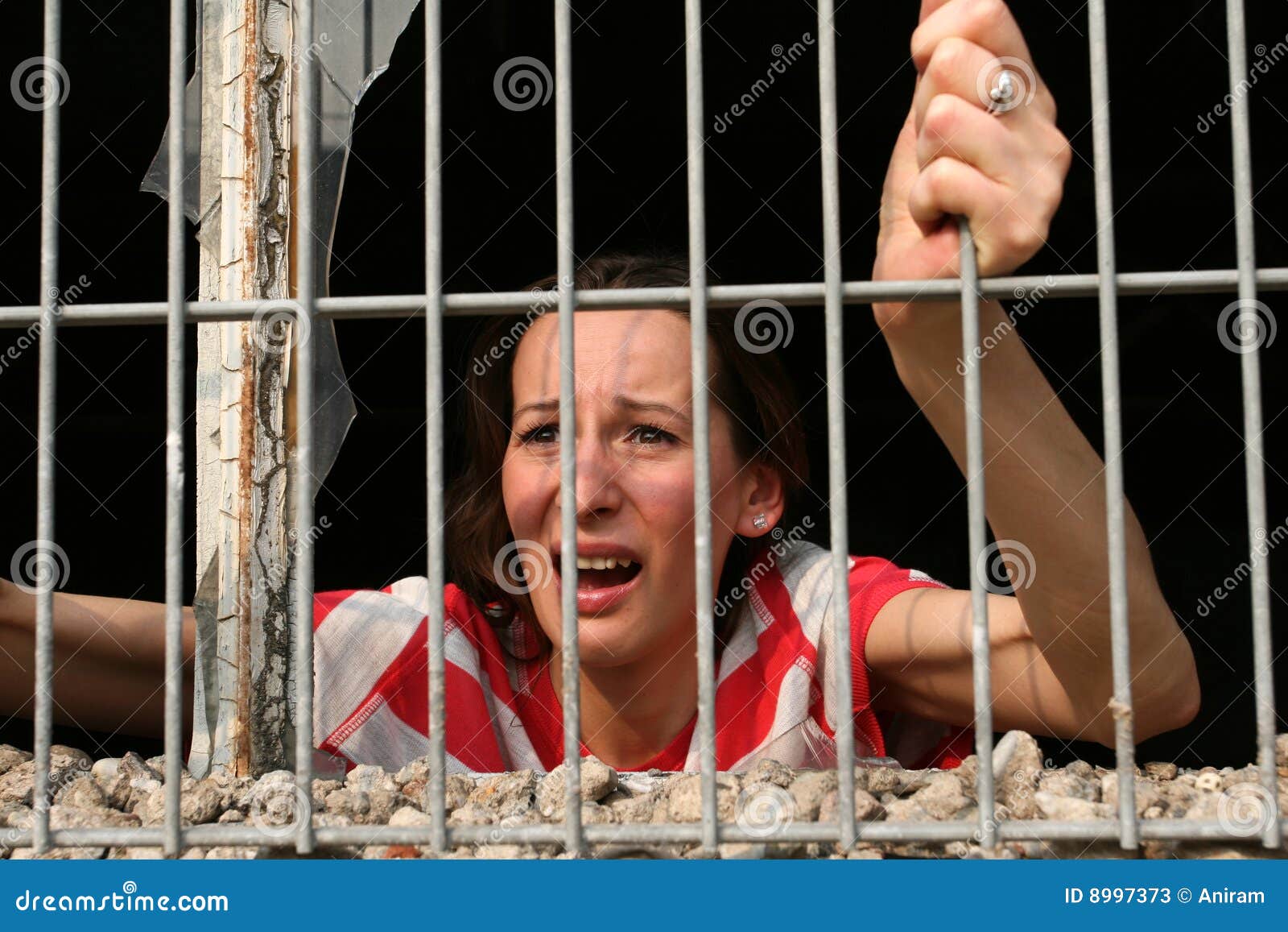 Woman behind bars crying stock image. Image of depressed - 8997373