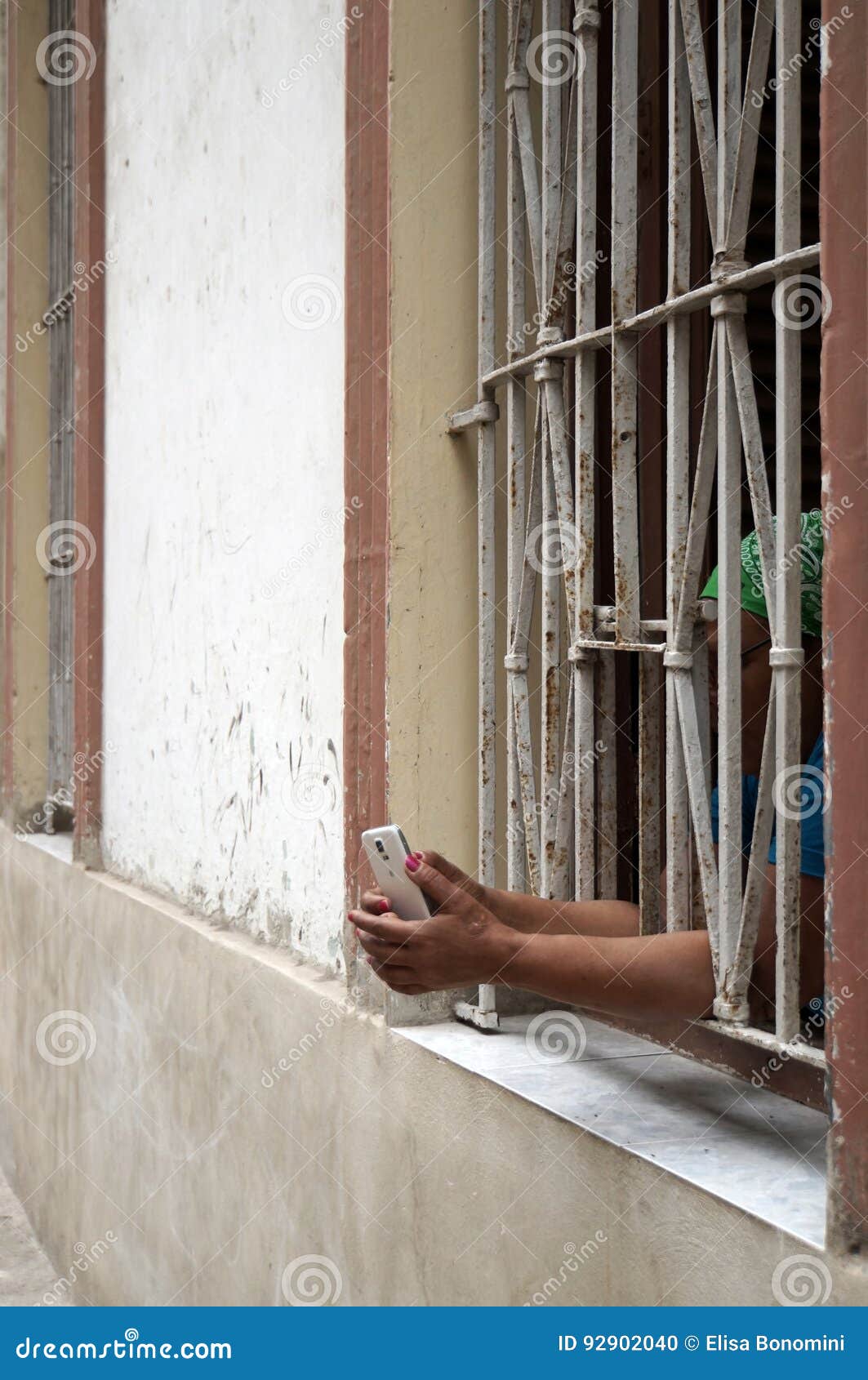 Woman Behind Bars Holding a Phone Editorial Image - Image of security ...