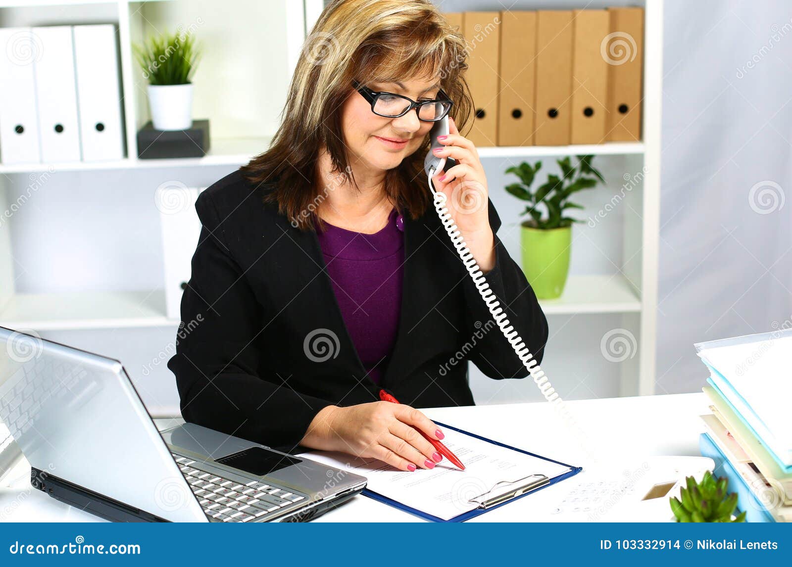 The Woman Behind the Desk in the Office Stock Photo - Image of paper ...