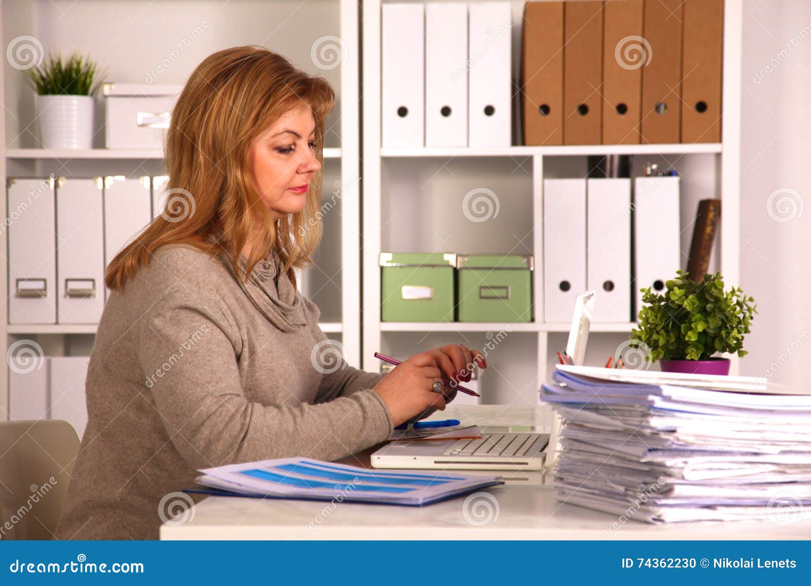 The Woman Behind the Desk in the Office Stock Photo - Image of notebook ...