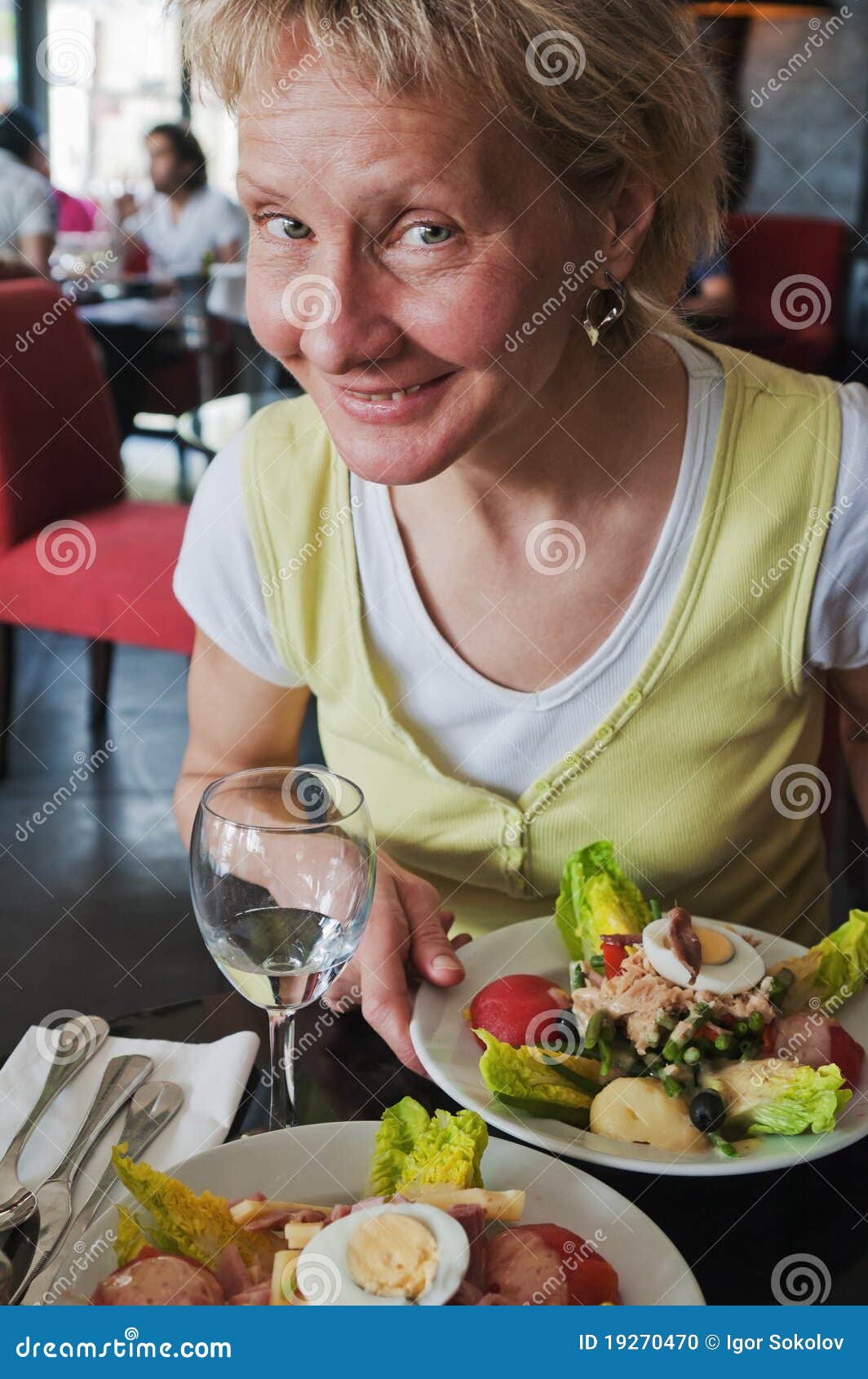 The Woman Behind a Little Table of the Restaurant Stock Photo - Image ...