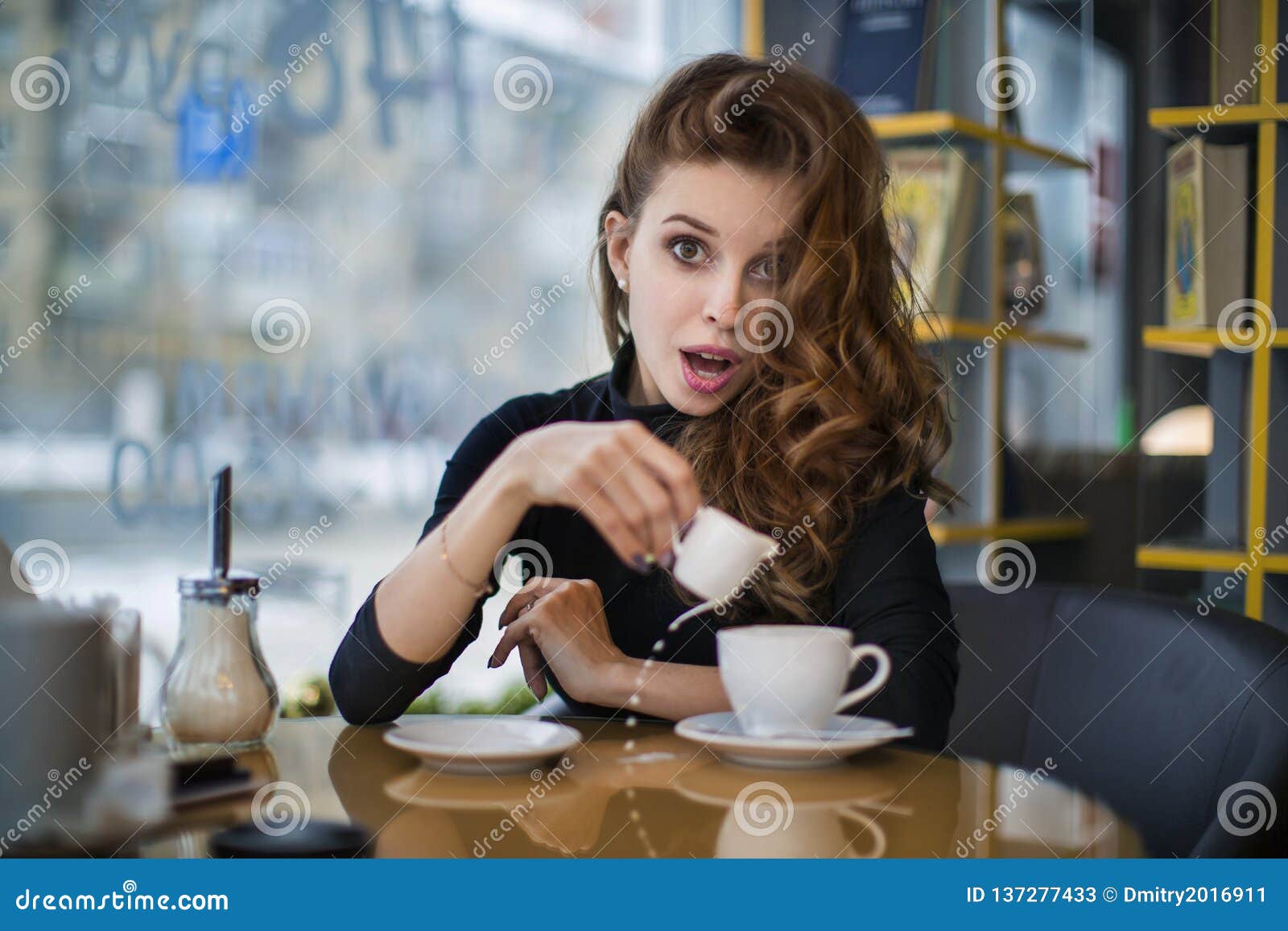 Woman Being Surprised at Cup Spilling. Looks at Camera. Stock Image ...