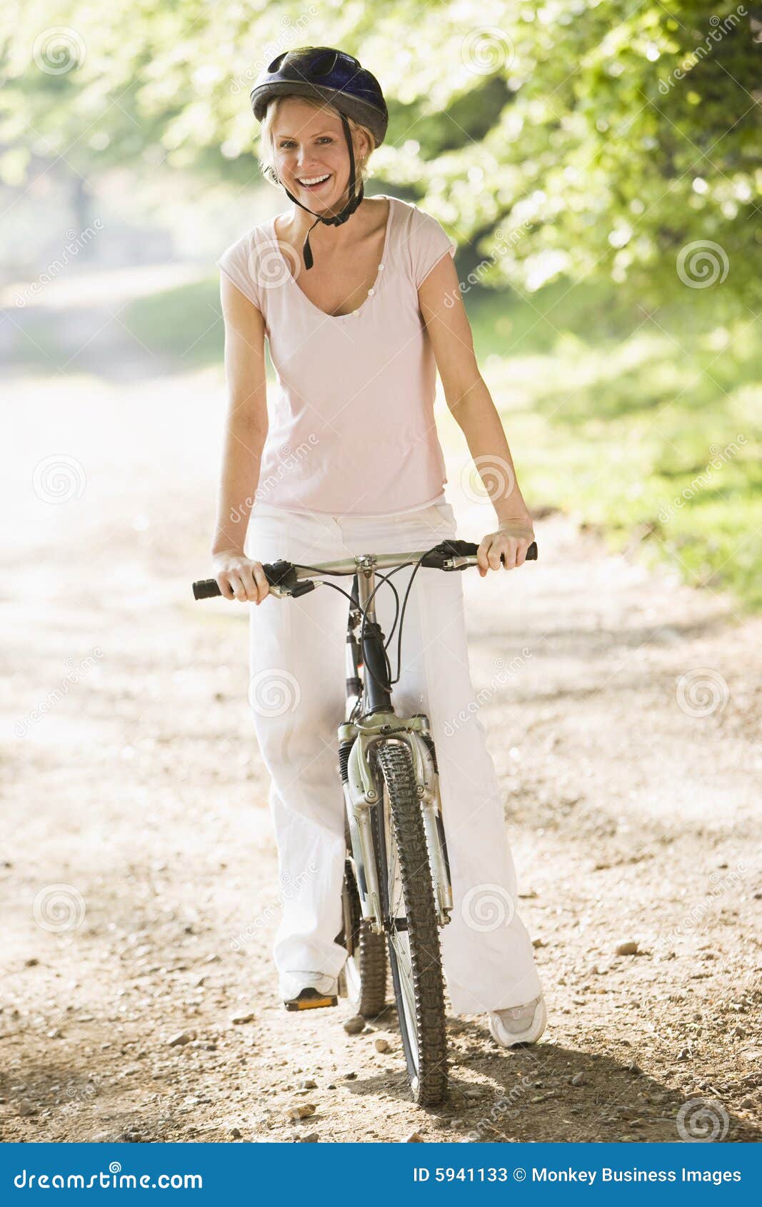 Woman on bicycle smiling stock image. Image of bicycle - 5941133