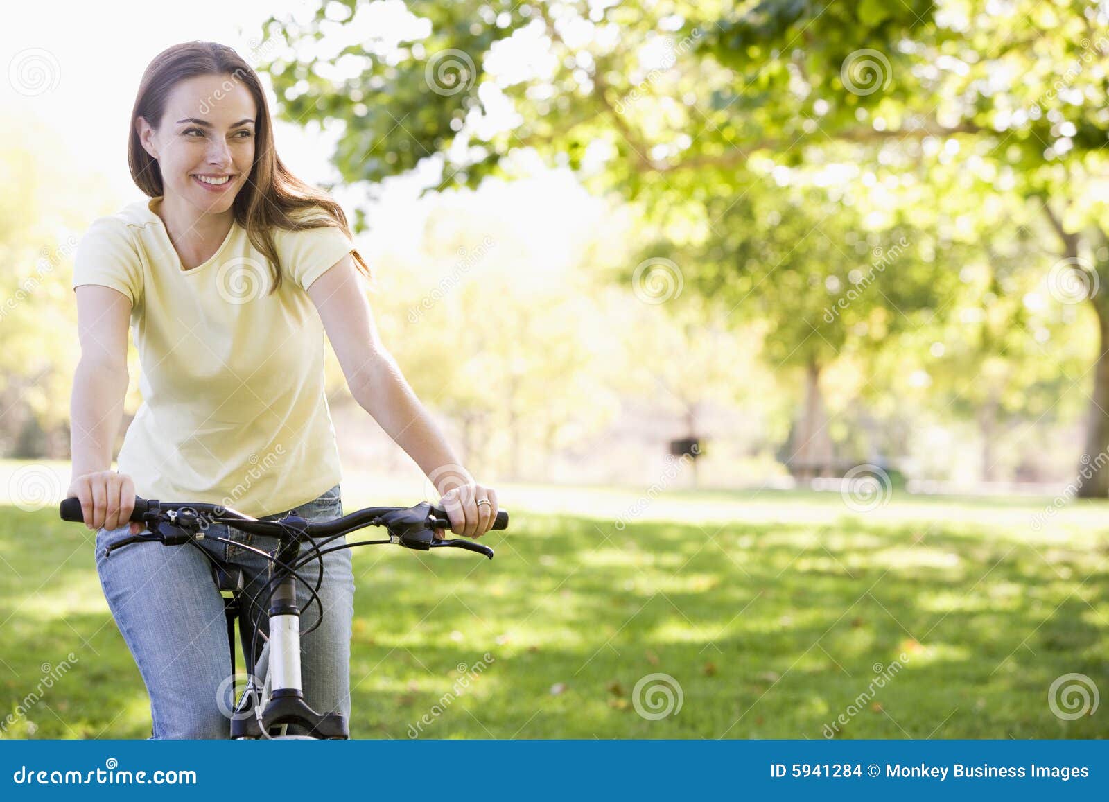 Woman on bicycle smiling stock photo. Image of mountain - 5941284