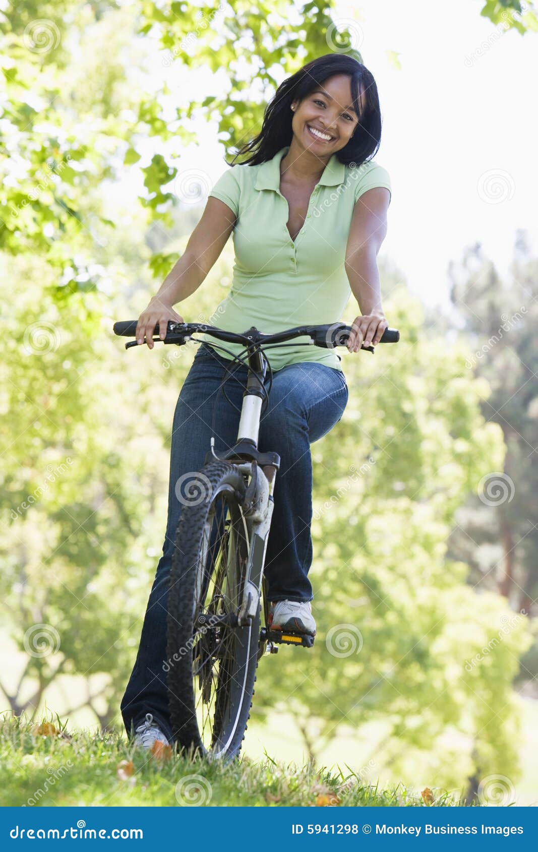 Woman on bicycle smiling stock photo. Image of countryside - 5941298