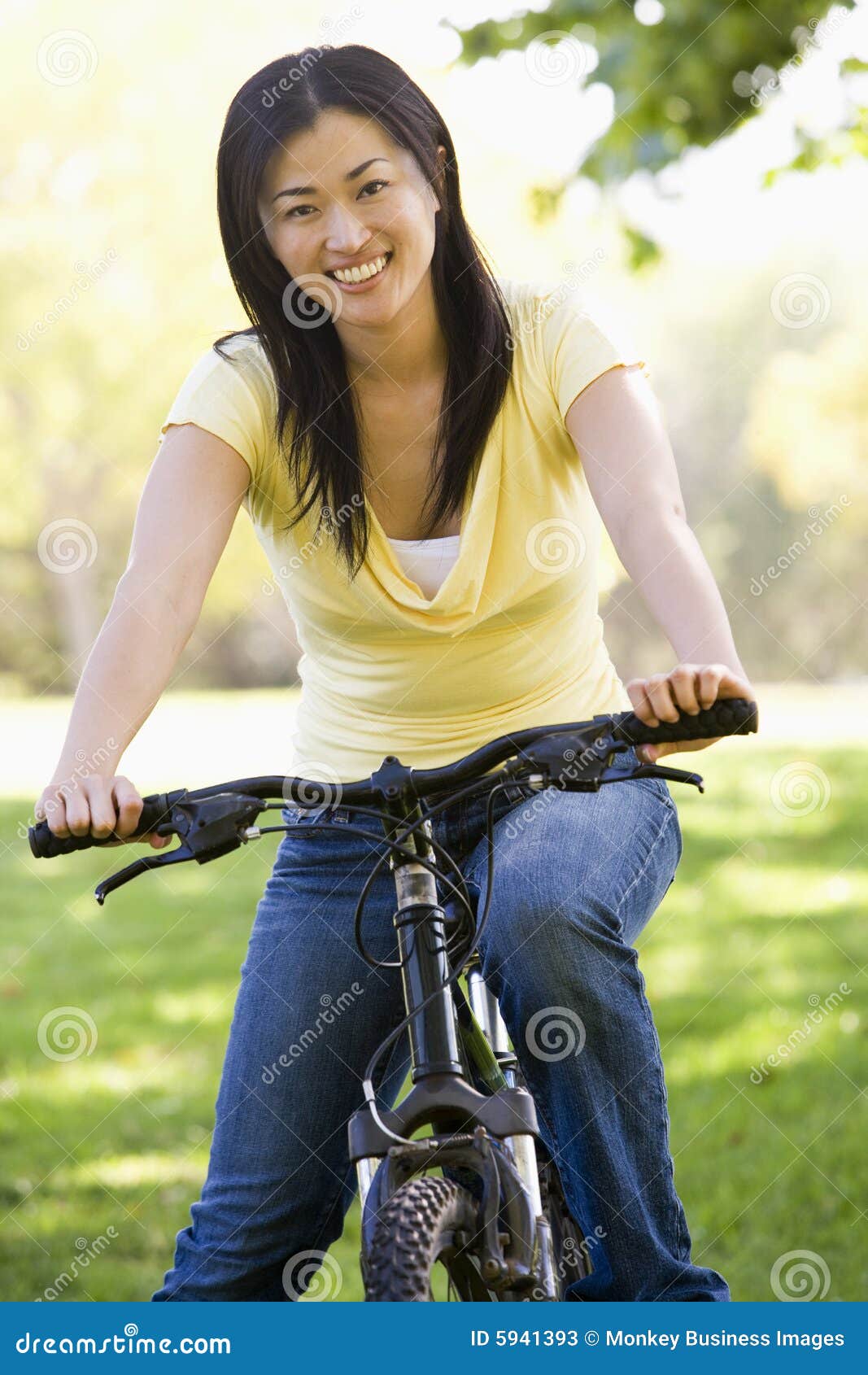 Woman on bicycle smiling stock image. Image of person - 5941393