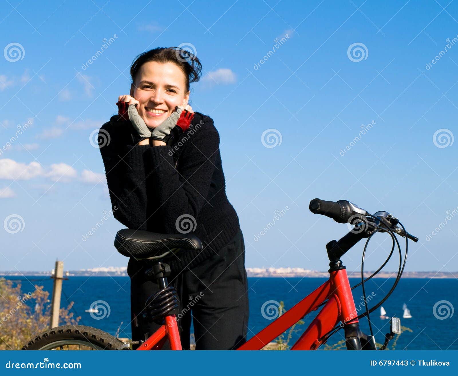 Woman on a bicycle smiling stock image. Image of biker - 6797443