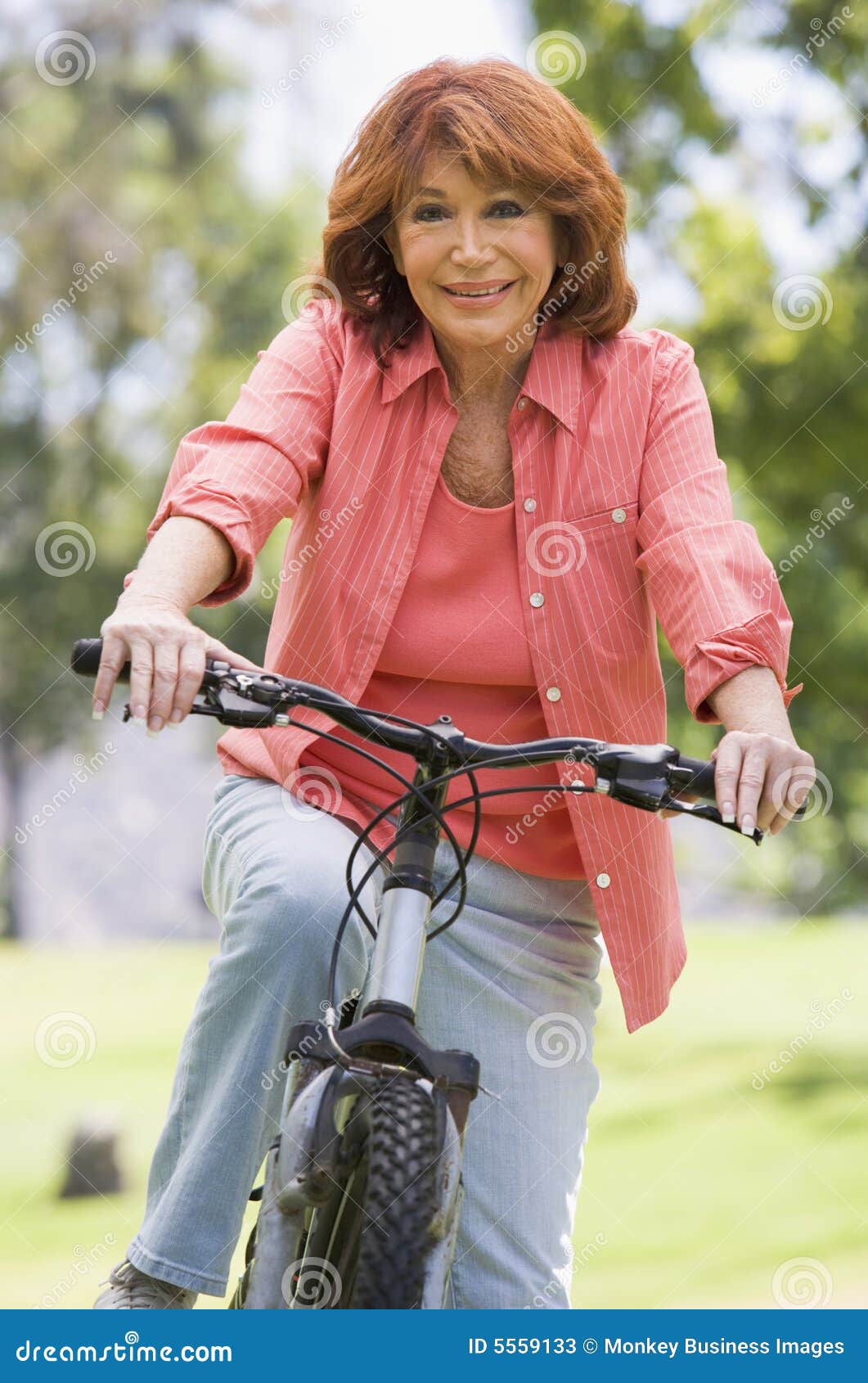 Woman on Bike Outdoors Smiling Stock Image - Image of sixties, bike ...