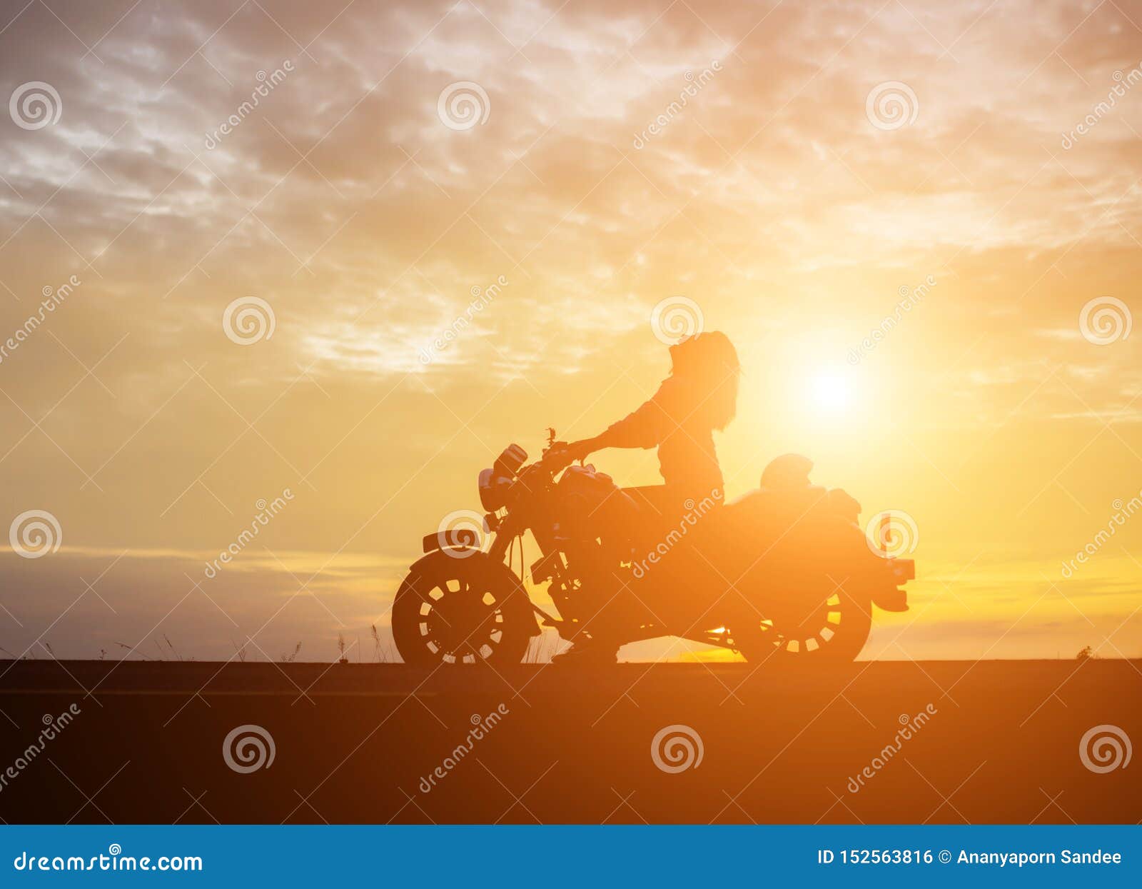 Woman biker over sunset stock photo. Image of horizontal - 152563816