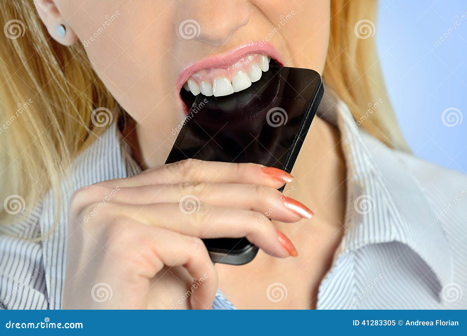 Woman bite phone stock image. Image of female, annoyed - 41283305