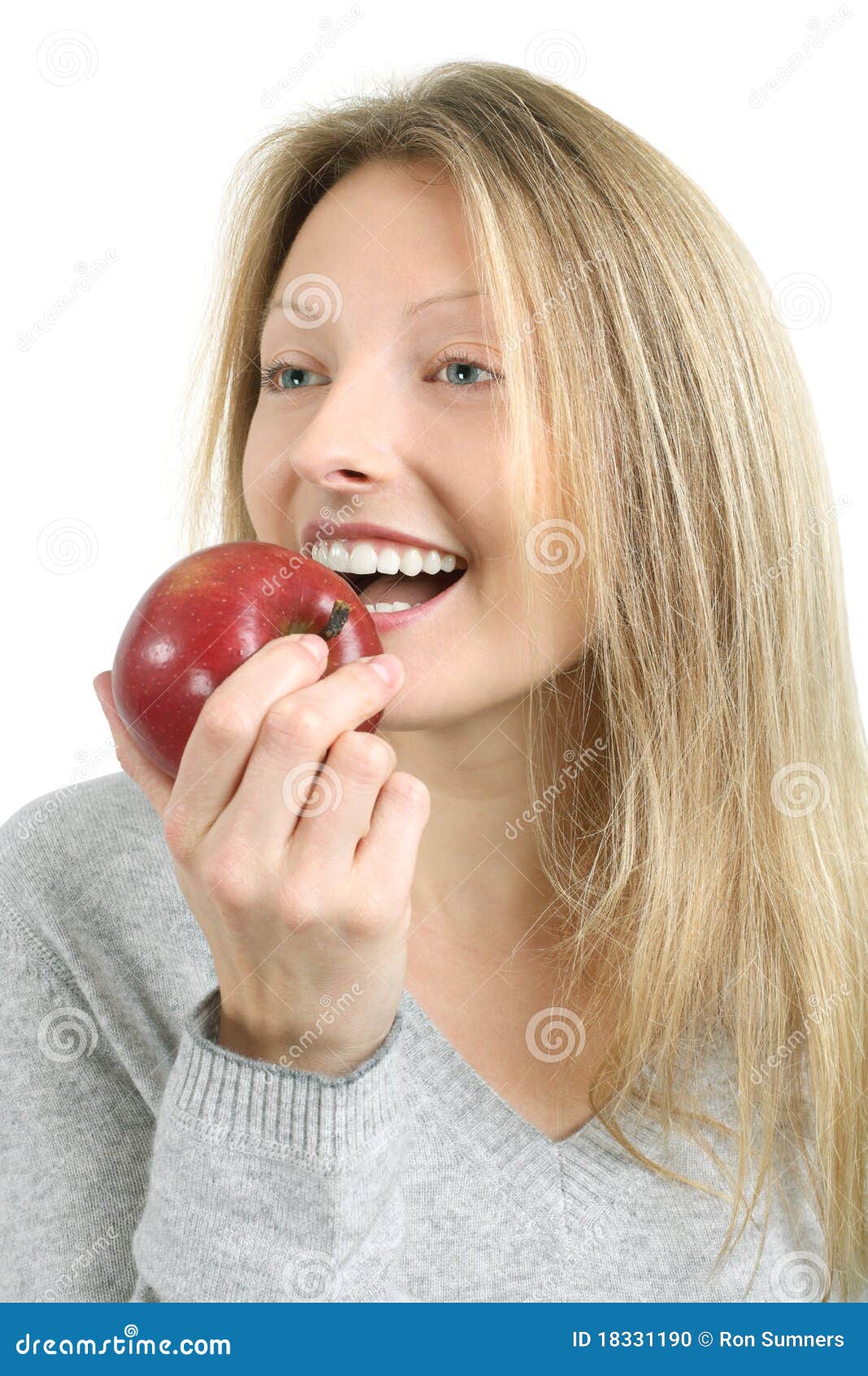 Woman biting into an apple stock photo. Image of eating - 18331190