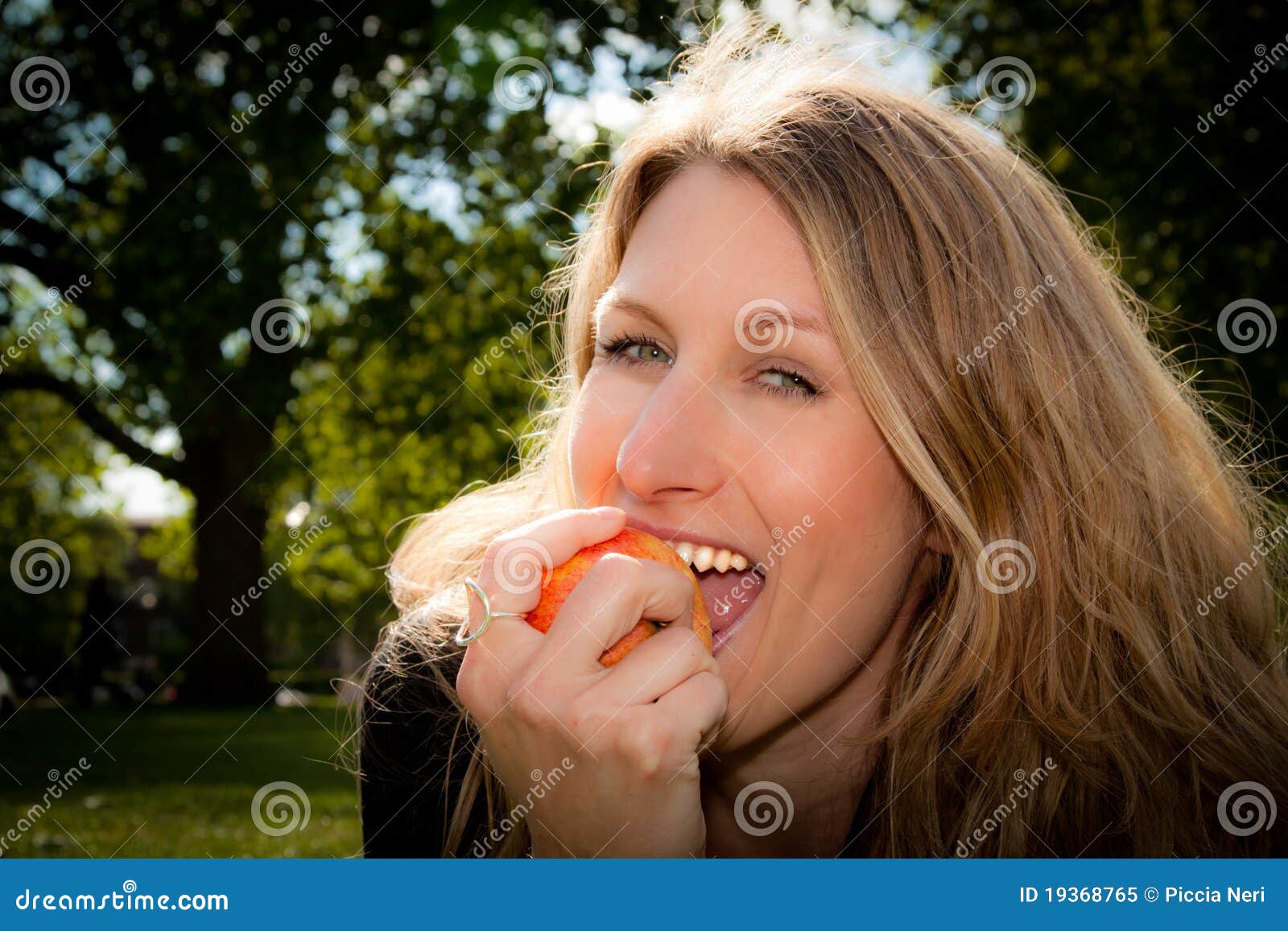 Woman biting an apple stock image. Image of biting, apple - 19368765