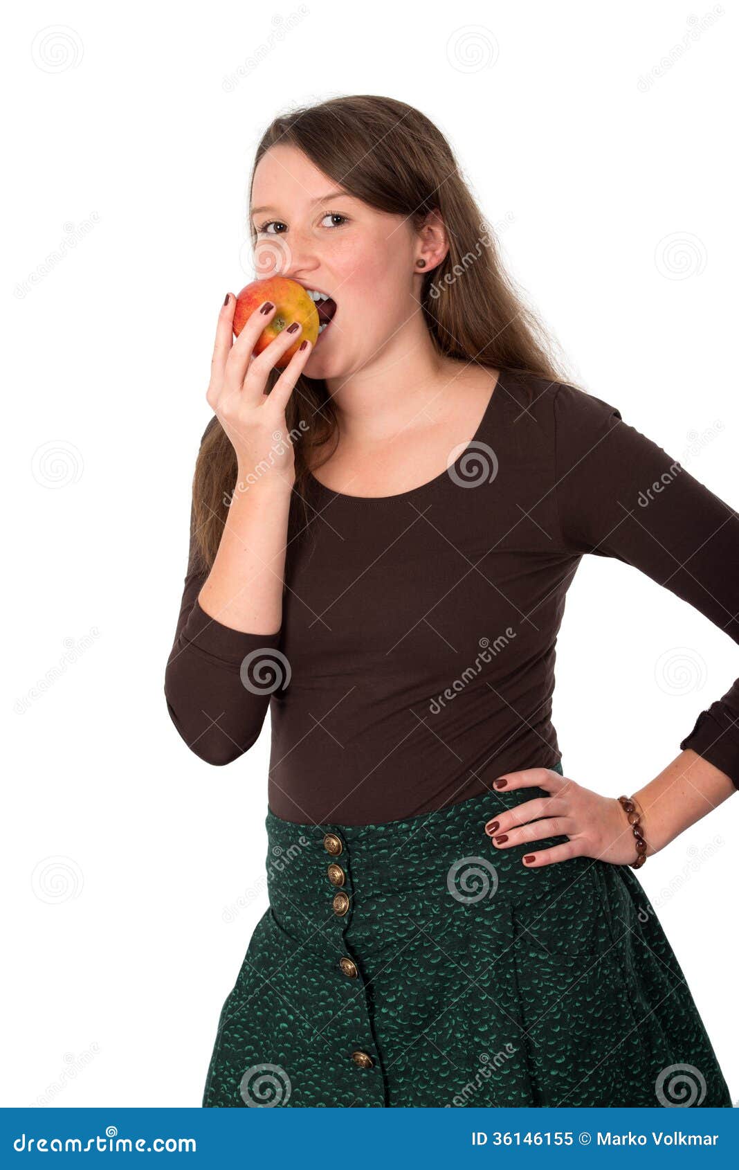 Woman is biting in a apple stock image. Image of brunette - 36146155