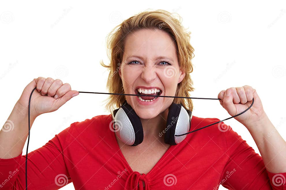 Woman biting in cable stock photo. Image of headphones - 12471278