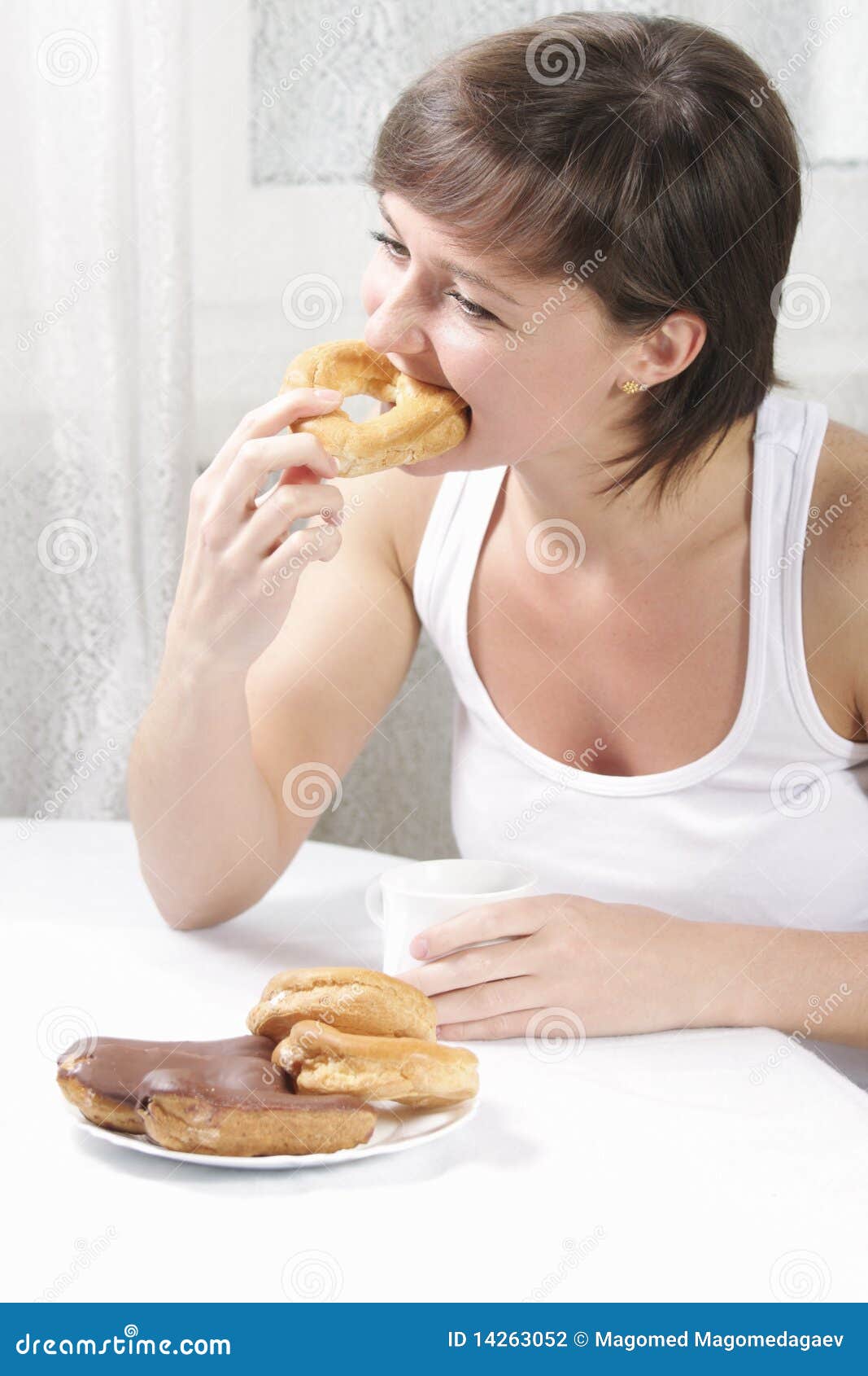 Woman biting cake stock photo. Image of housewife, vertical - 14263052