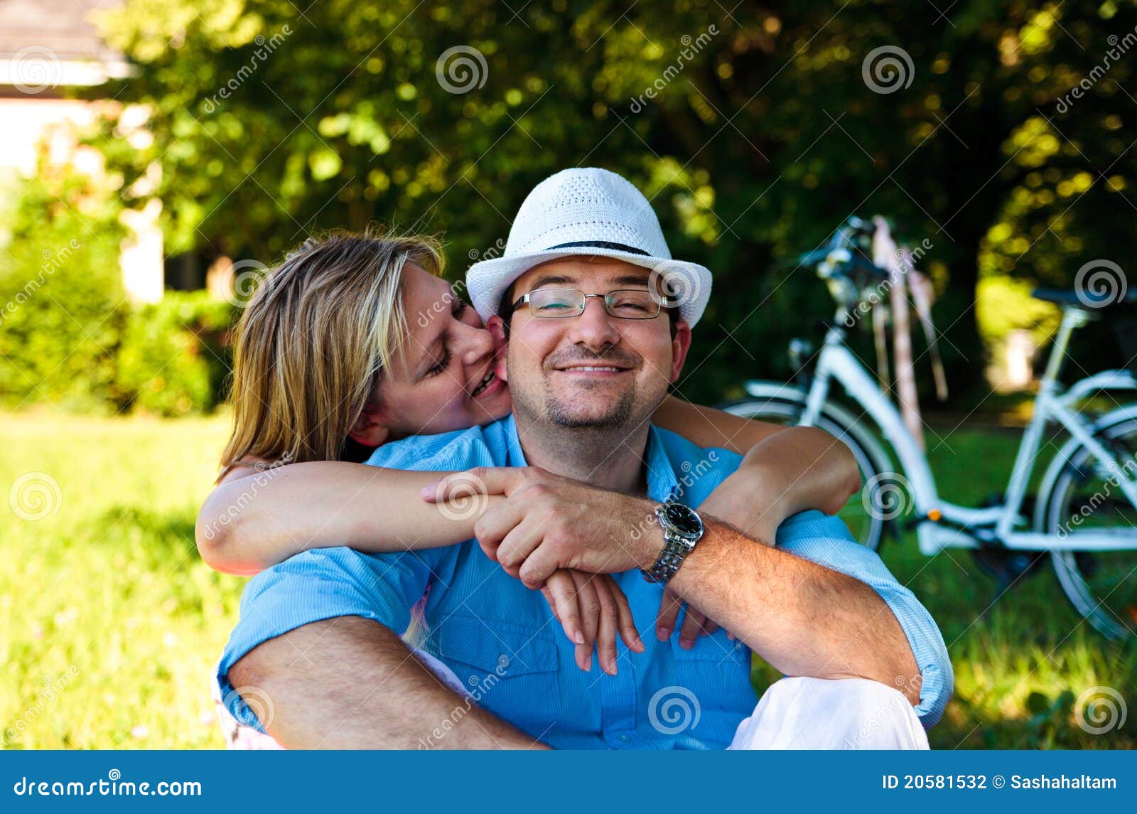 Woman biting ear of man stock photo. Image of bite, green - 20581532