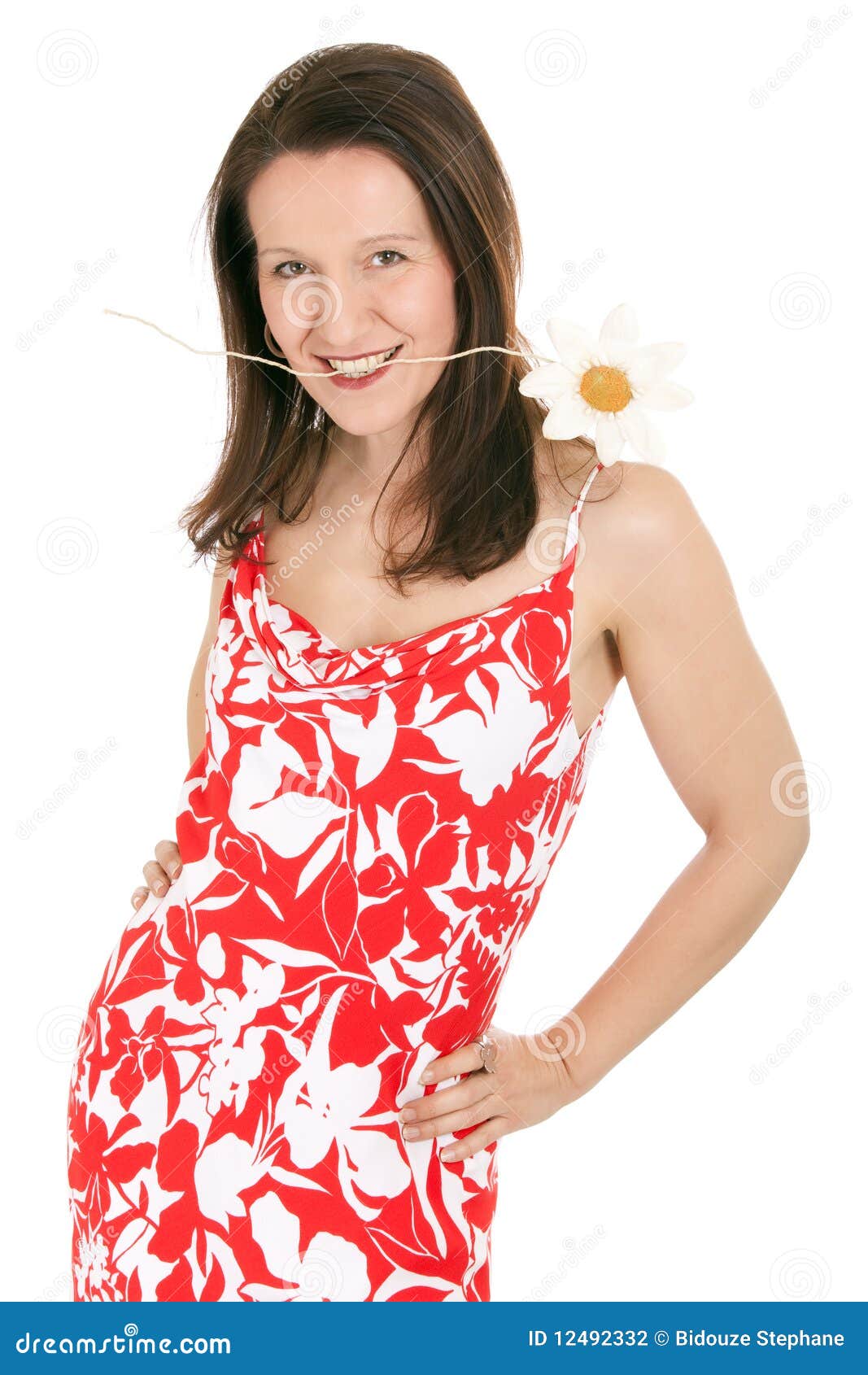 Woman biting flower stock photo. Image of dress, flower - 12492332