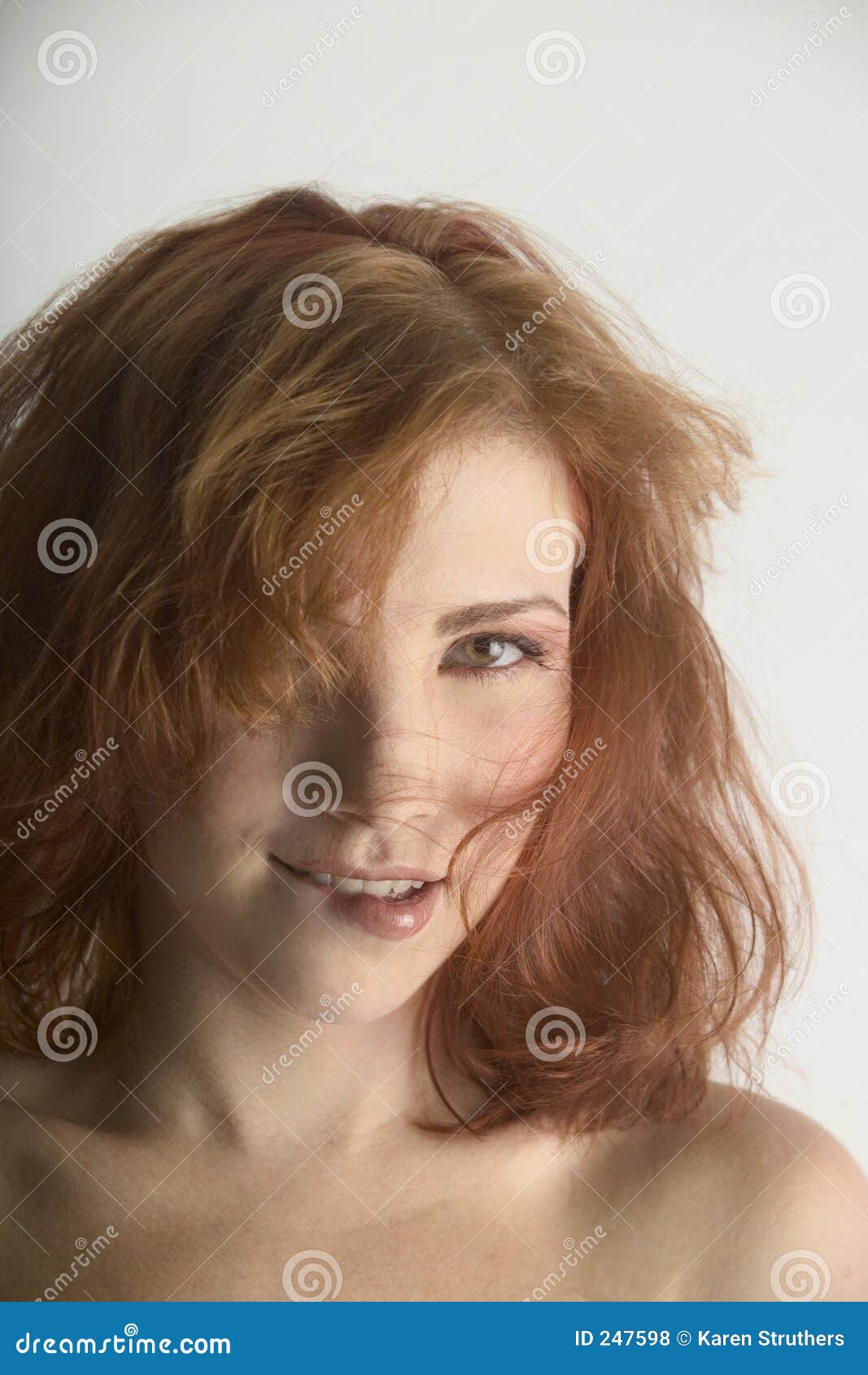 Woman Biting Her Lip with Mussed Hair Stock Photo - Image of woman ...