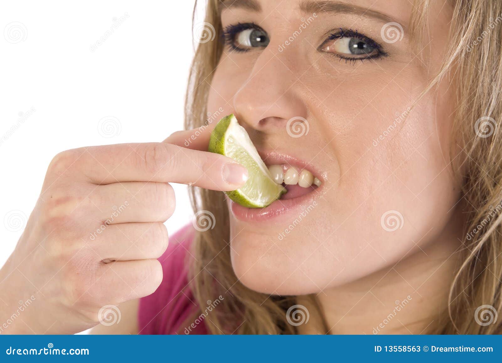 Woman biting lime stock image. Image of teeth, tropical - 13558563
